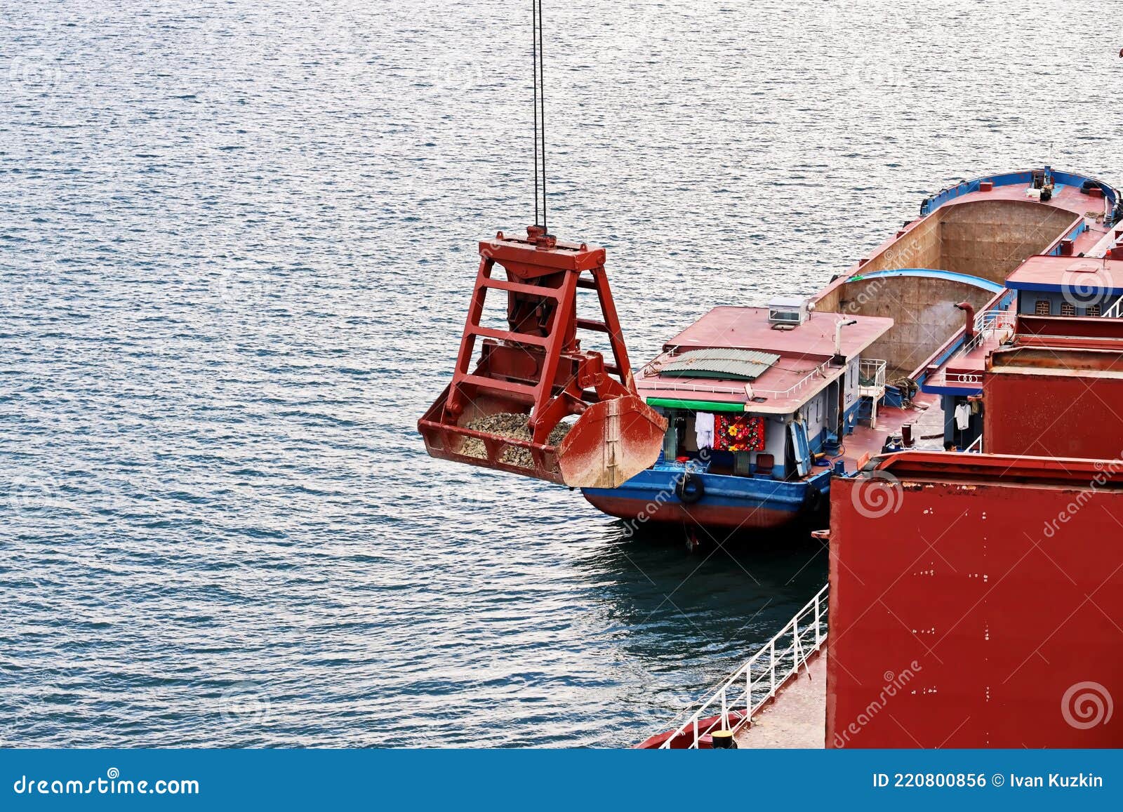 Loading Bulk Cargo of Limestone from Barges into a Bulk Carrier by ...