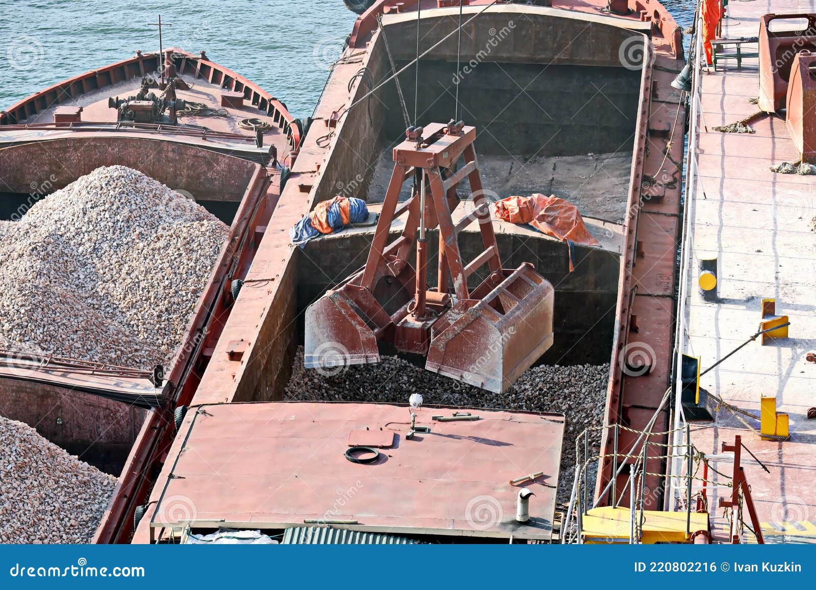 Loading Bulk Cargo of Limestone from Barges into a Bulk Carrier by ...