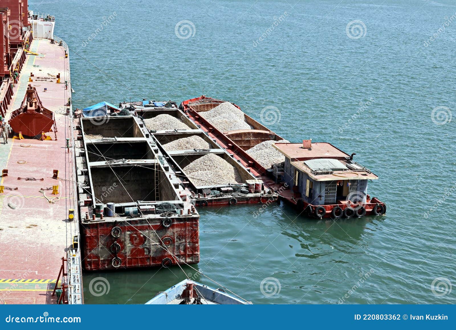 Loading Bulk Cargo of Limestone from Barges into a Bulk Carrier by ...