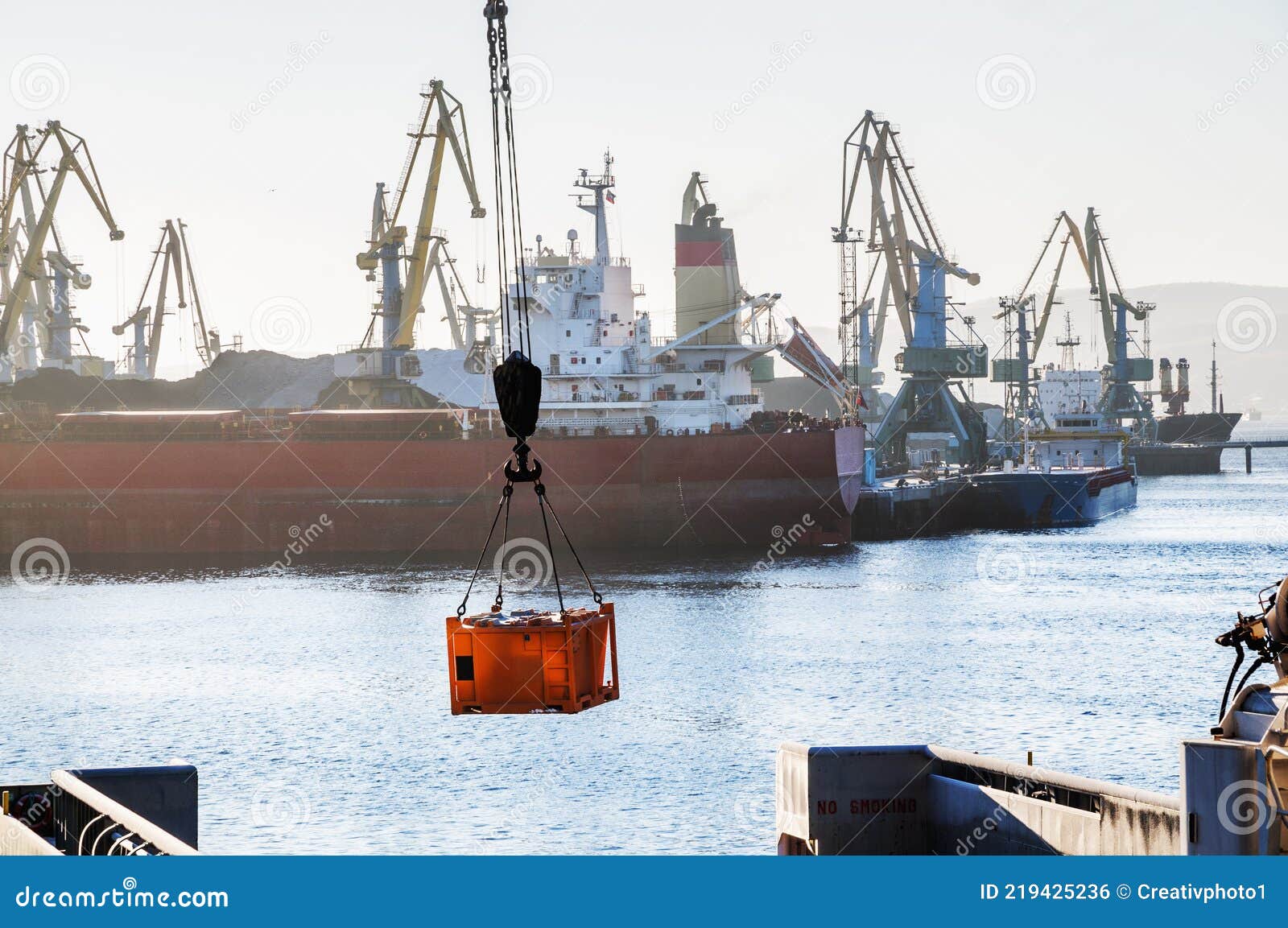 Loading Cargo on Board Vessel at the Port Stock Photo - Image of cargo ...