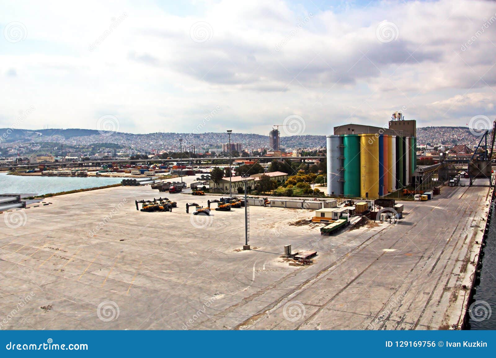 Loading Cargo of Cement Clinker in Bulk Carrier by Ships Cranes in the ...