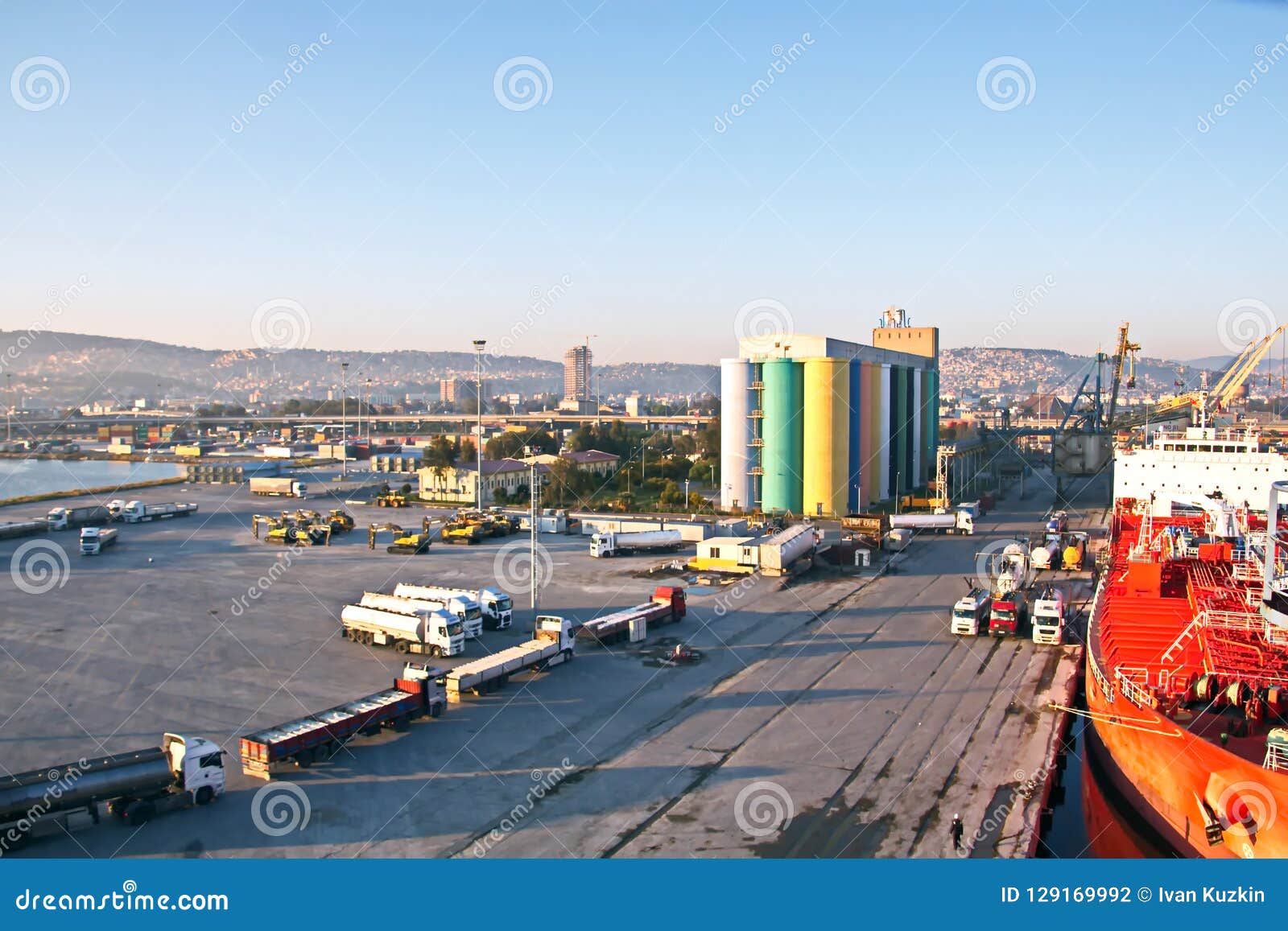 Loading Cargo of Cement Clinker in Bulk Carrier by Ships Cranes in the ...