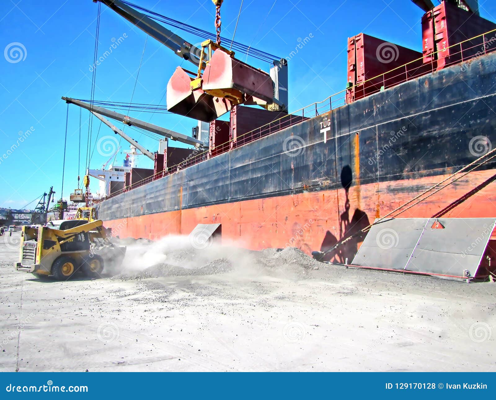 Loading Cargo of Cement Clinker in Bulk Carrier by Ships Cranes in the ...