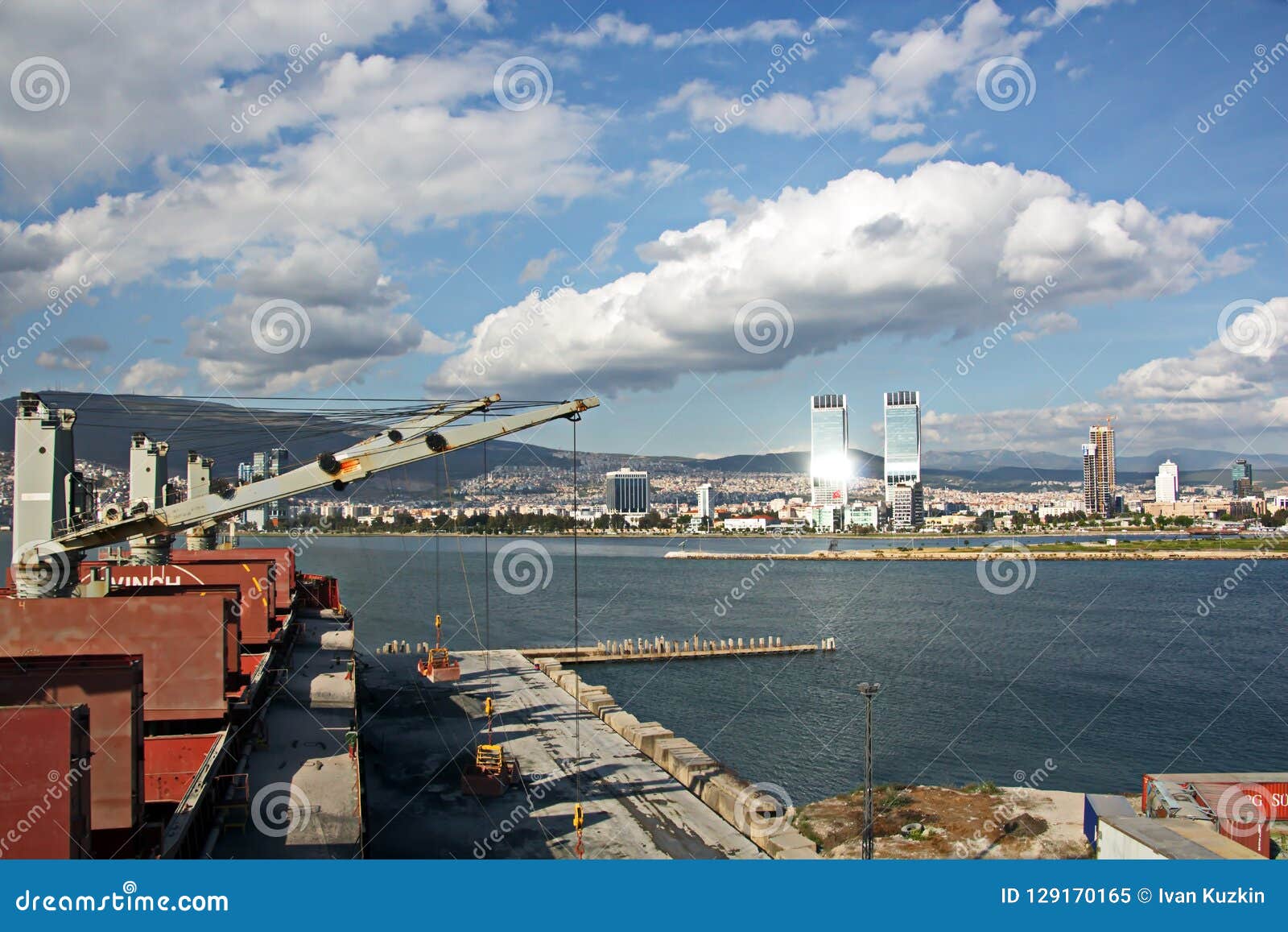 Loading Cargo of Cement Clinker in Bulk Carrier by Ships Cranes in the ...