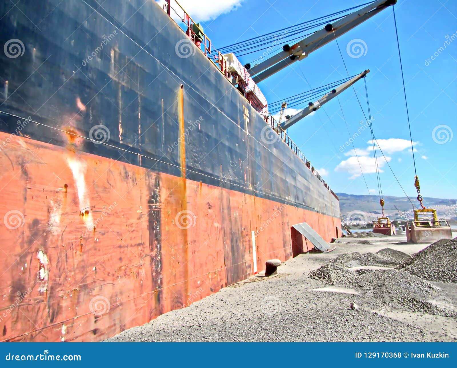 Loading Cargo of Cement Clinker in Bulk Carrier Vessel by Ships Cranes ...