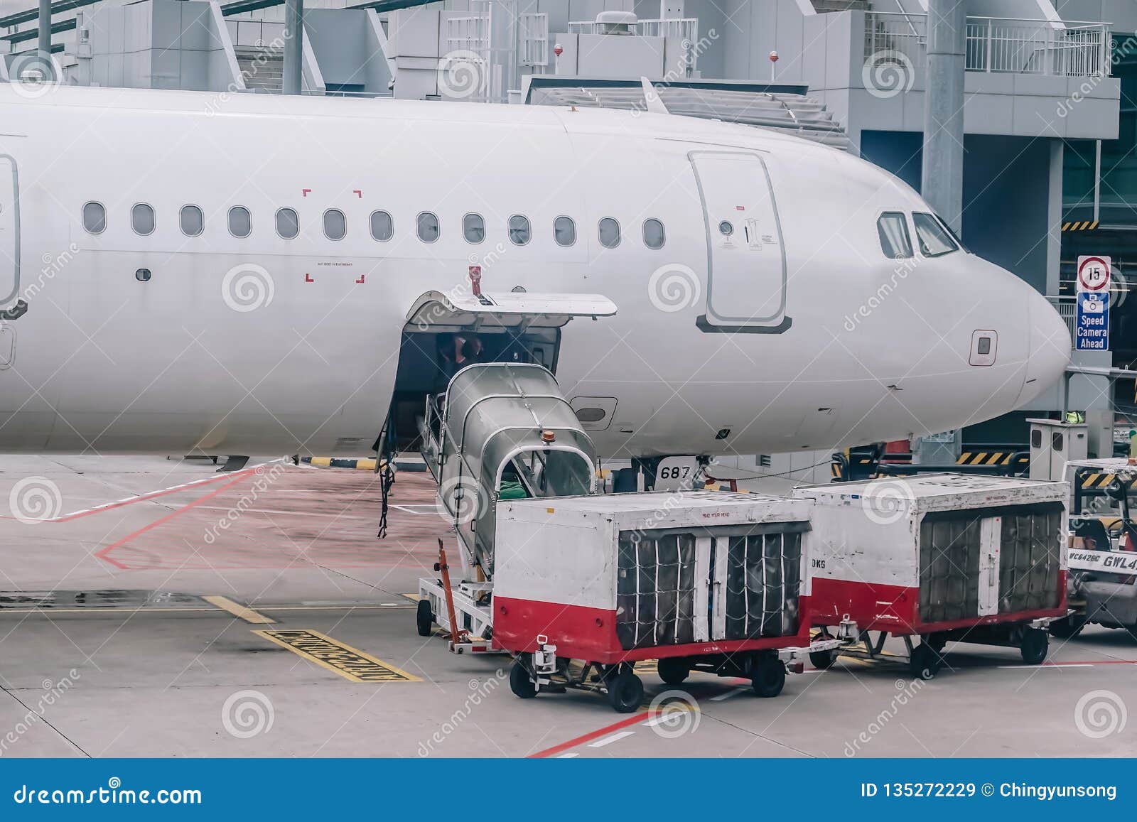 Loading Cargo on the Plane in Airport. Editorial Stock Image - Image of ...