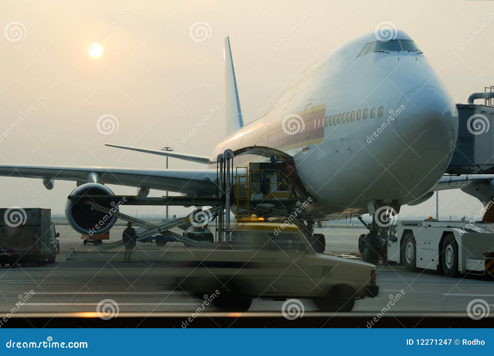 Loading cargo to airplane stock image. Image of boeing - 12271247