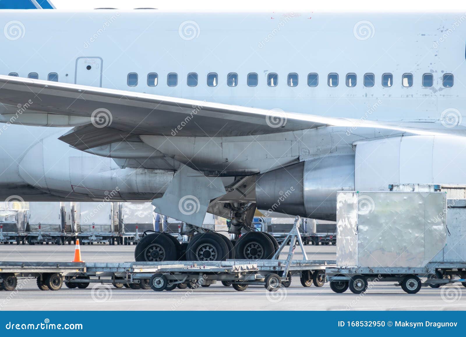 Loading cargo to plane stock photo. Image of service - 168532950