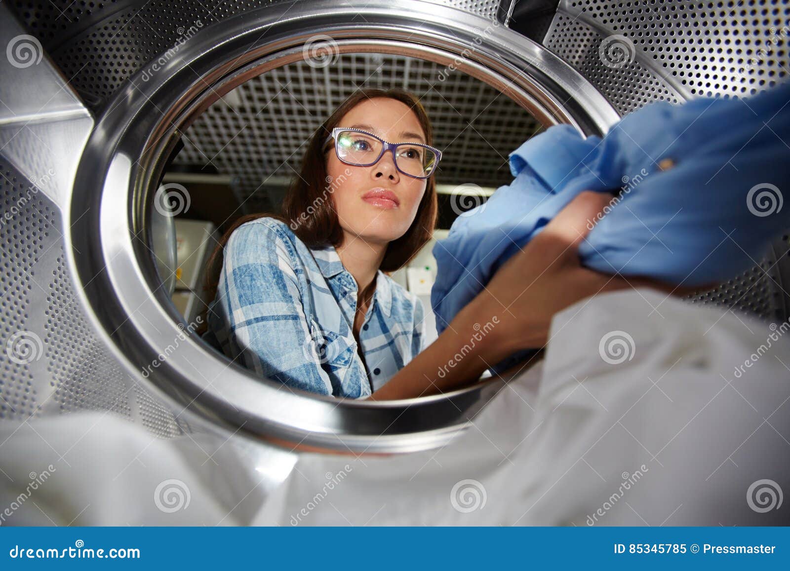 Loading Clothes into Tumble Stock Image - Image of laundrette ...