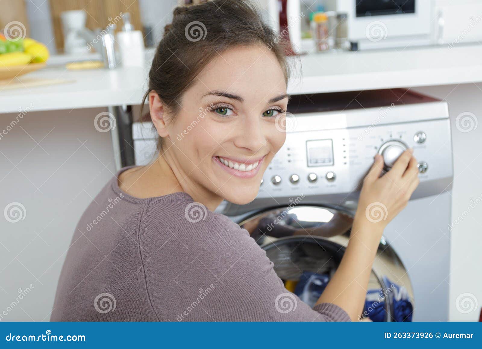 Loading Clothes into Washing Machine Stock Photo - Image of woman ...