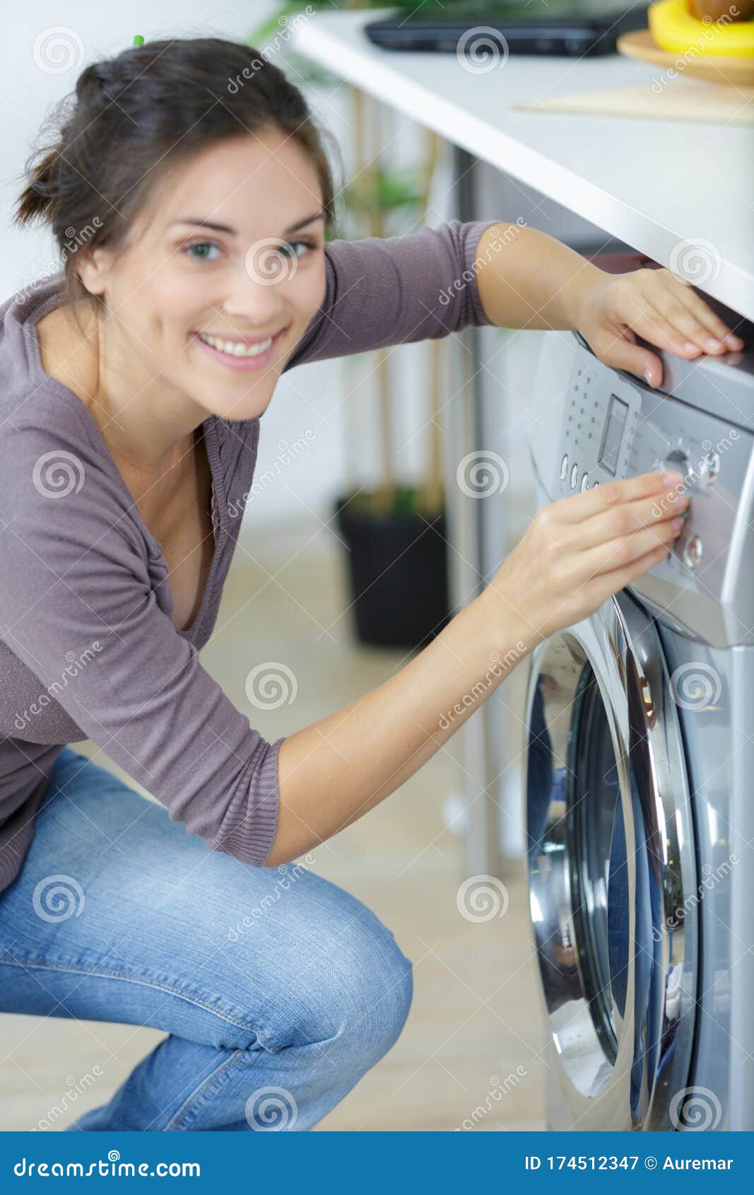 Loading Clothes into Washing Machine Stock Image - Image of kitchen ...