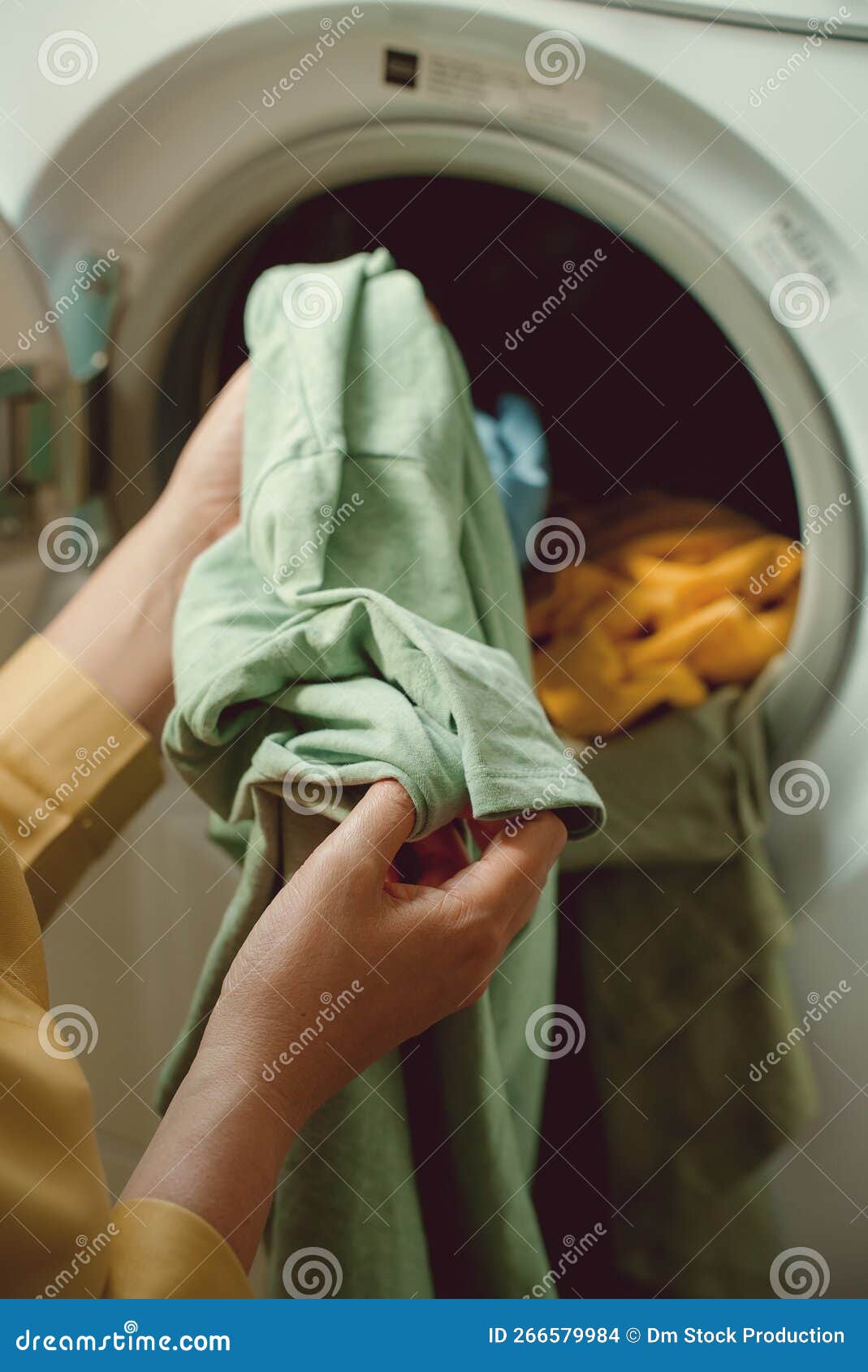 Loading Clothes into Washing Machine Stock Photo - Image of dryer ...