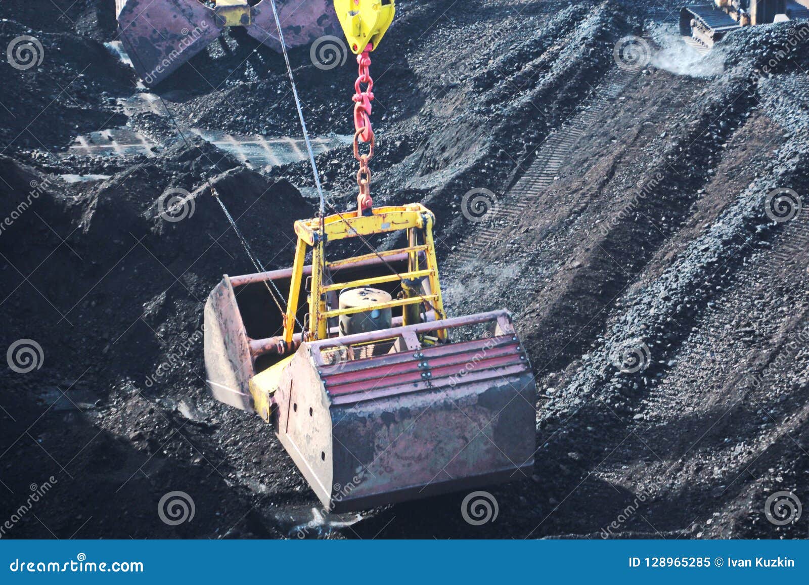 Loading Coal from Cargo Barges Onto a Bulk Carrier Using Ship Cranes ...