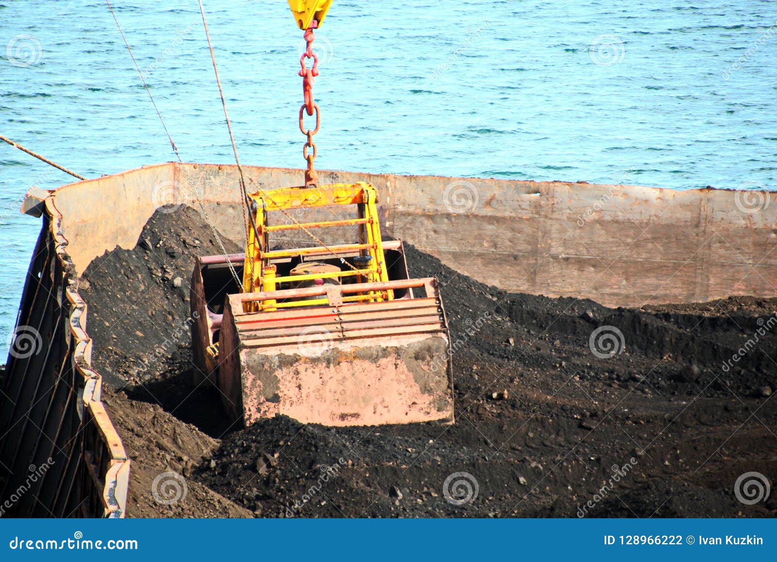 Loading Coal from Cargo Barges Onto a Bulk Carrier Using Ship Cranes ...