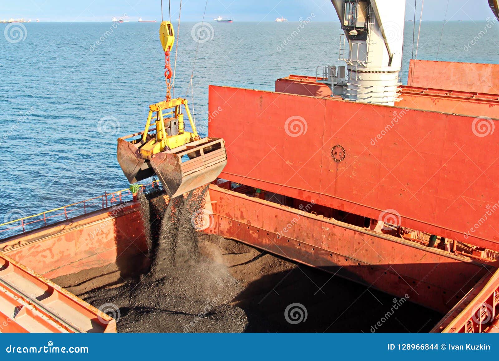Loading Coal from Cargo Barges Onto a Bulk Carrier Using Ship Cranes ...