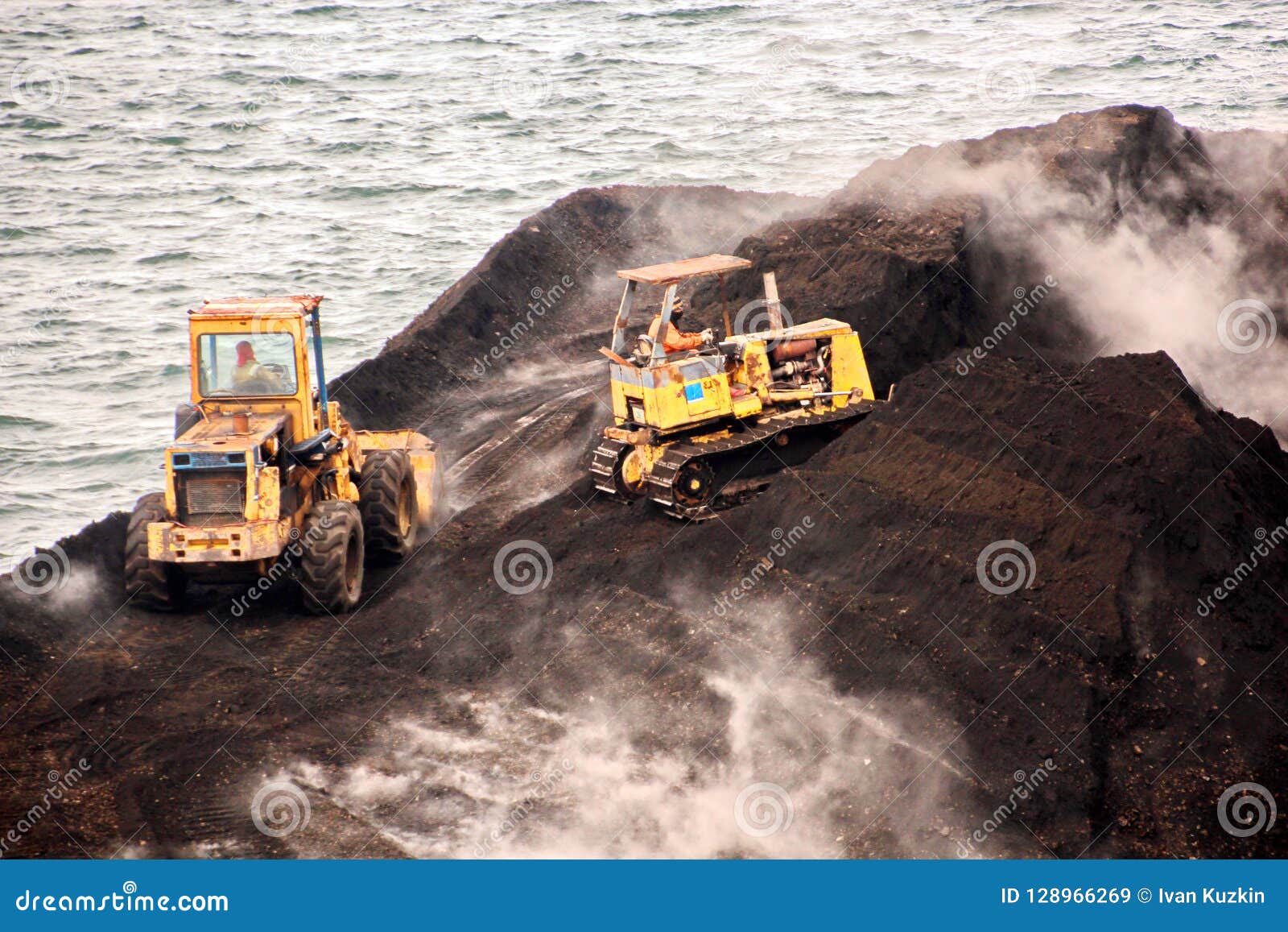 Loading Coal from Cargo Barges Onto a Bulk Carrier Using Ship Cranes ...