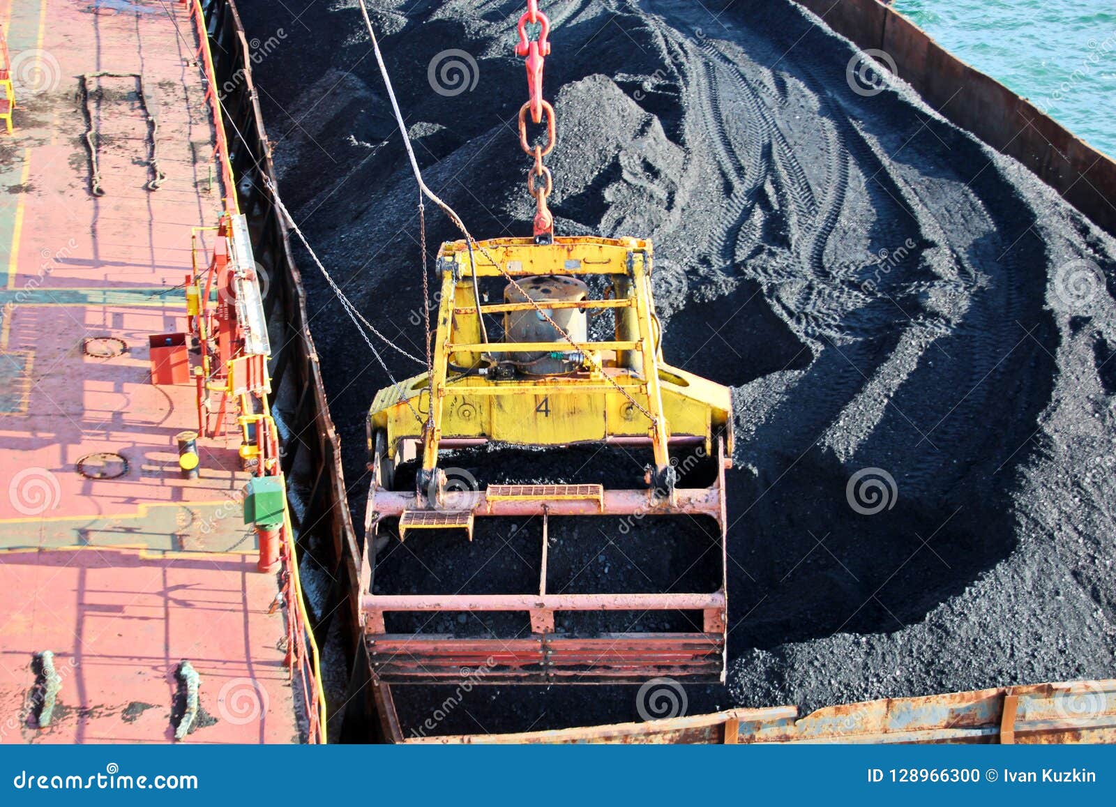 Loading Coal from Cargo Barges Onto a Bulk Carrier Using Ship Cranes ...