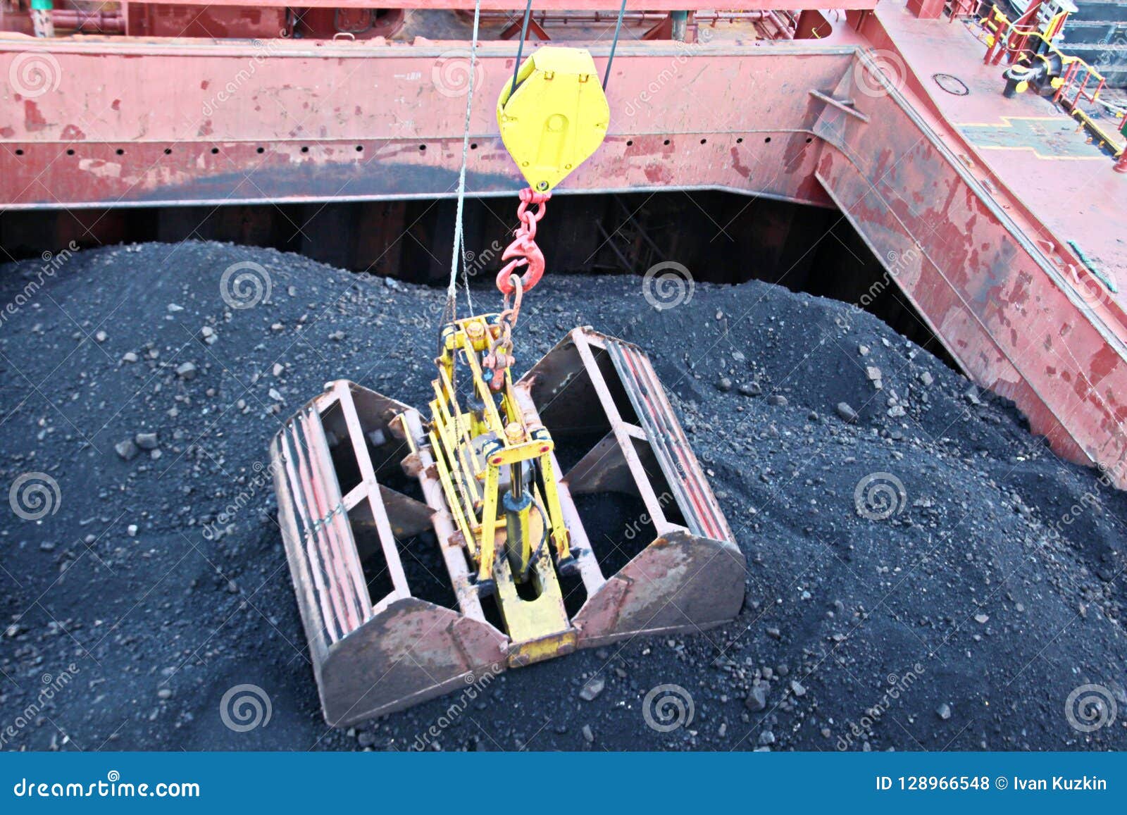 Loading Coal from Cargo Barges Onto a Bulk Carrier Using Ship Cranes ...