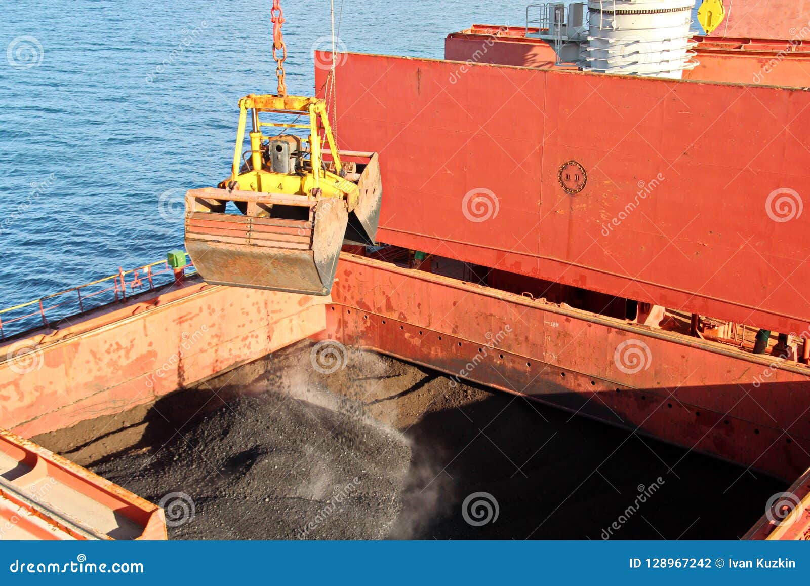 Loading Coal from Cargo Barges Onto a Bulk Carrier Using Ship Cranes ...
