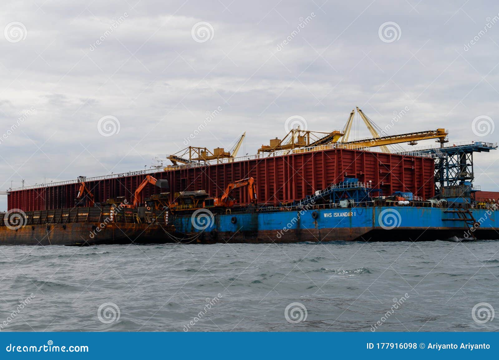 Loading Coal from Cargo Barges Onto a Bulk Vessel Using Ship Cranes ...