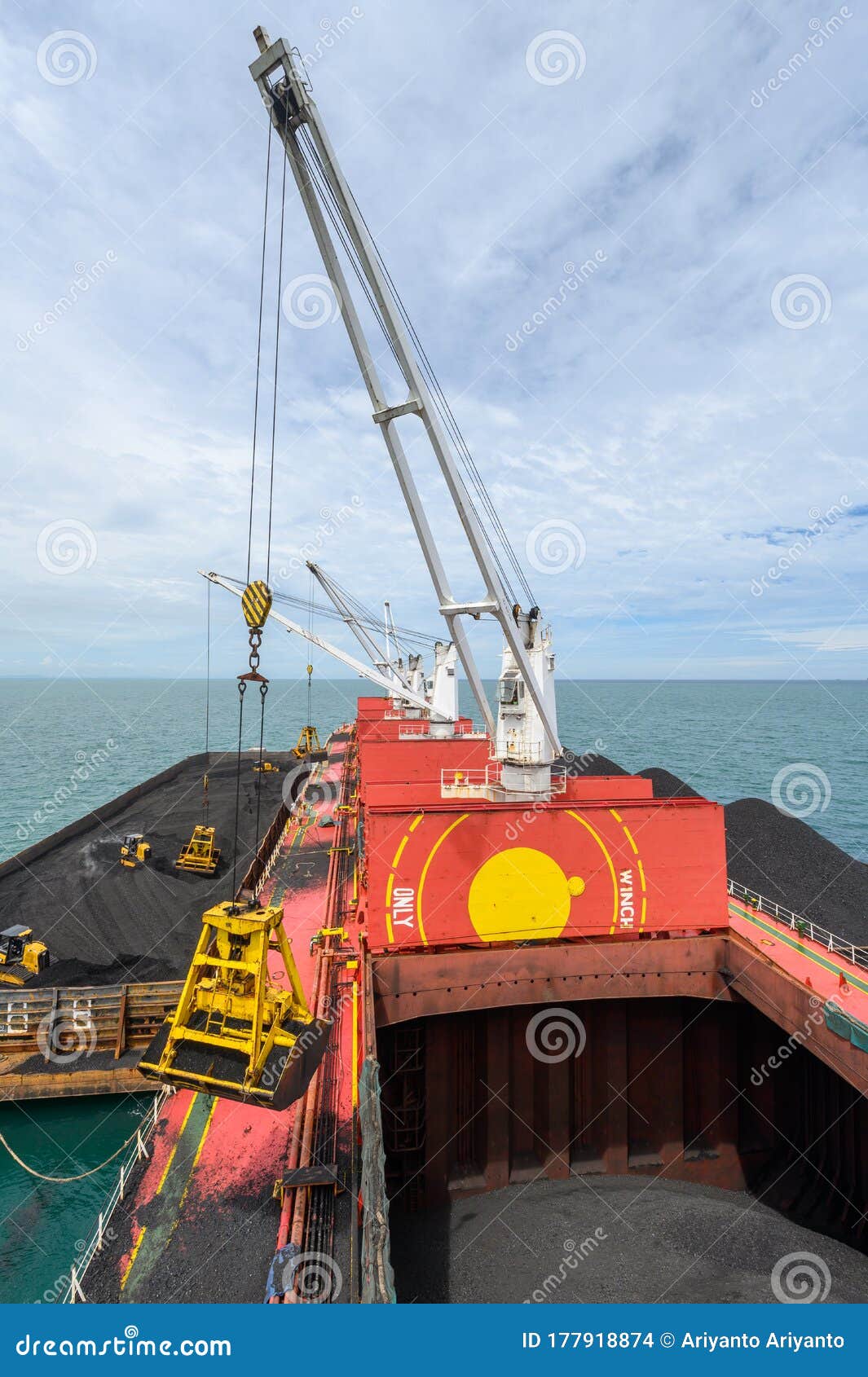 Loading Coal from Cargo Barges Onto a Bulk Vessel Using Ship Cranes ...