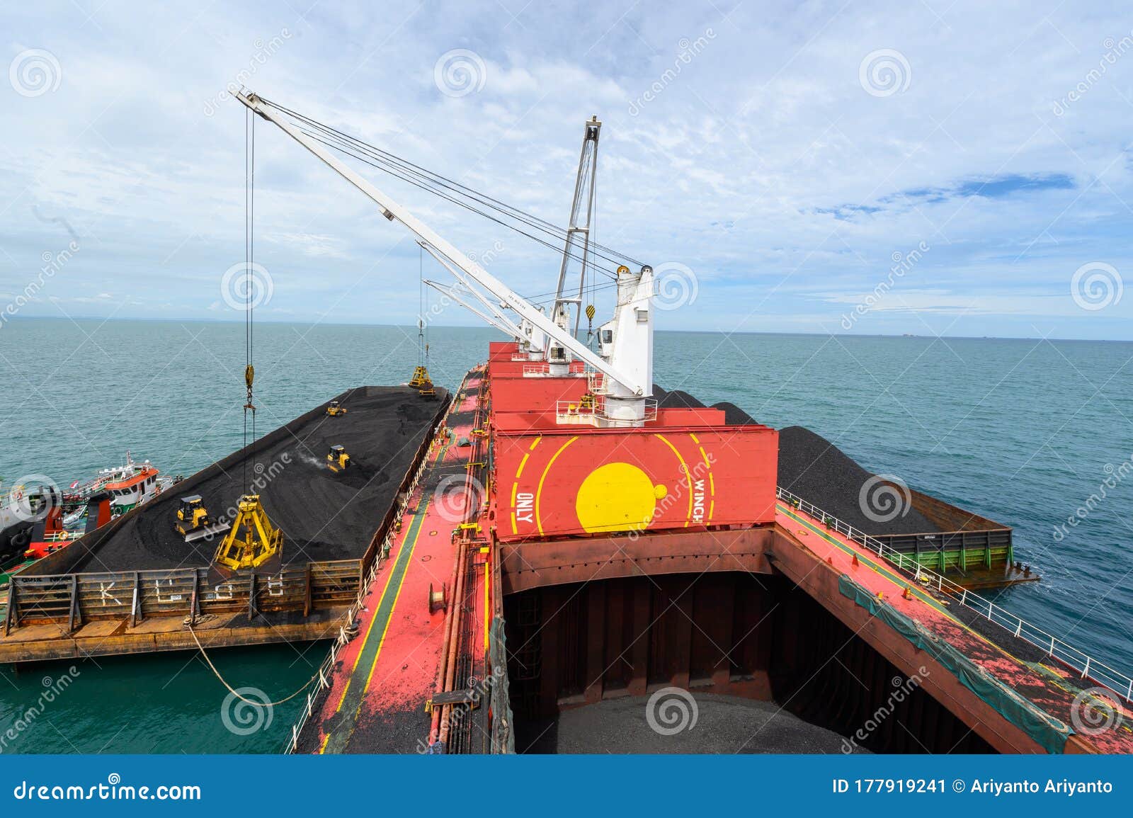 Loading Coal from Cargo Barges Onto a Bulk Vessel Using Ship Cranes ...