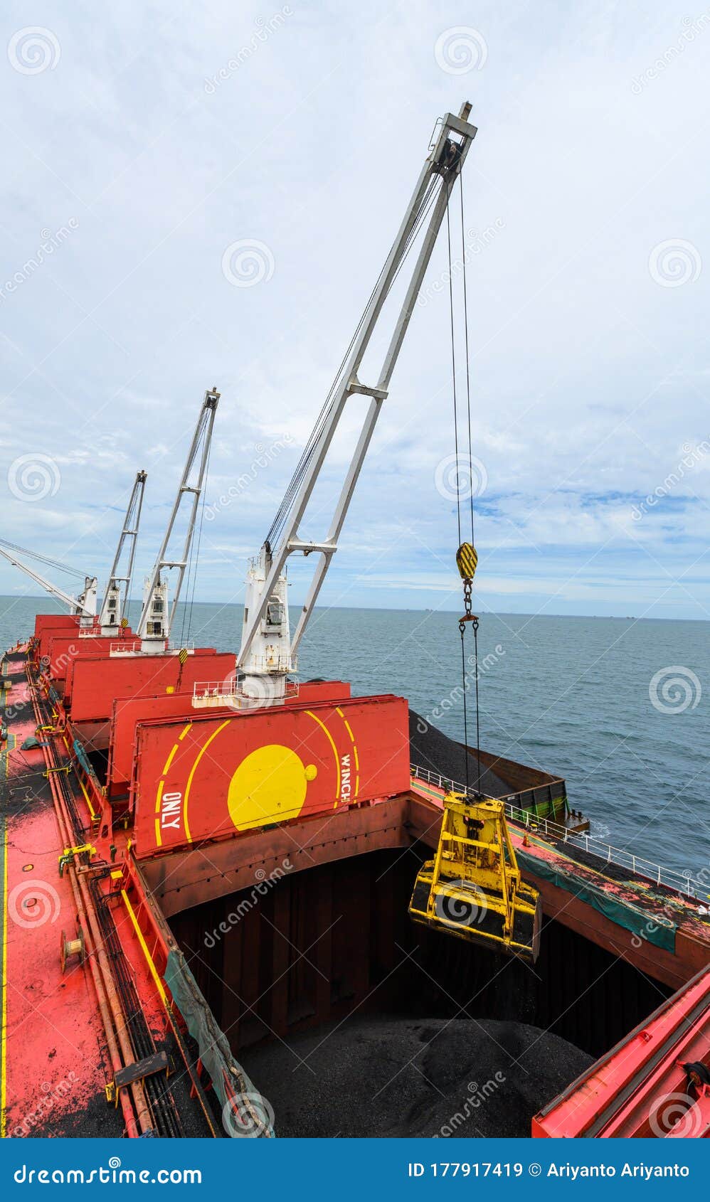 Loading Coal from Cargo Barges Onto a Bulk Vessel Using Ship Cranes ...