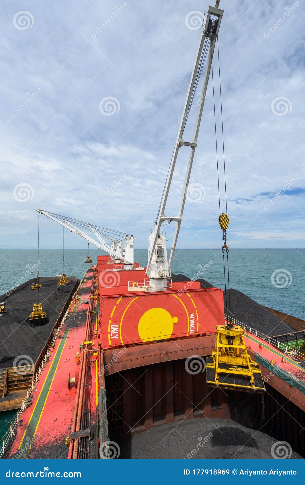 Loading Coal from Cargo Barges Onto a Bulk Vessel Using Ship Cranes ...