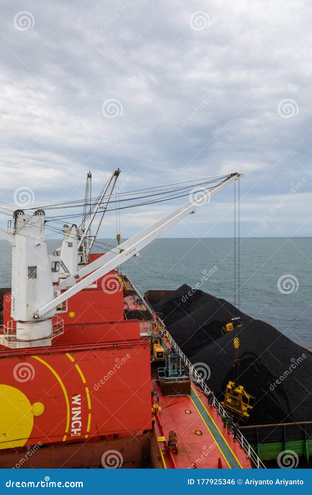 Loading Coal from Cargo Barges Onto a Bulk Vessel Using Ship Cranes ...