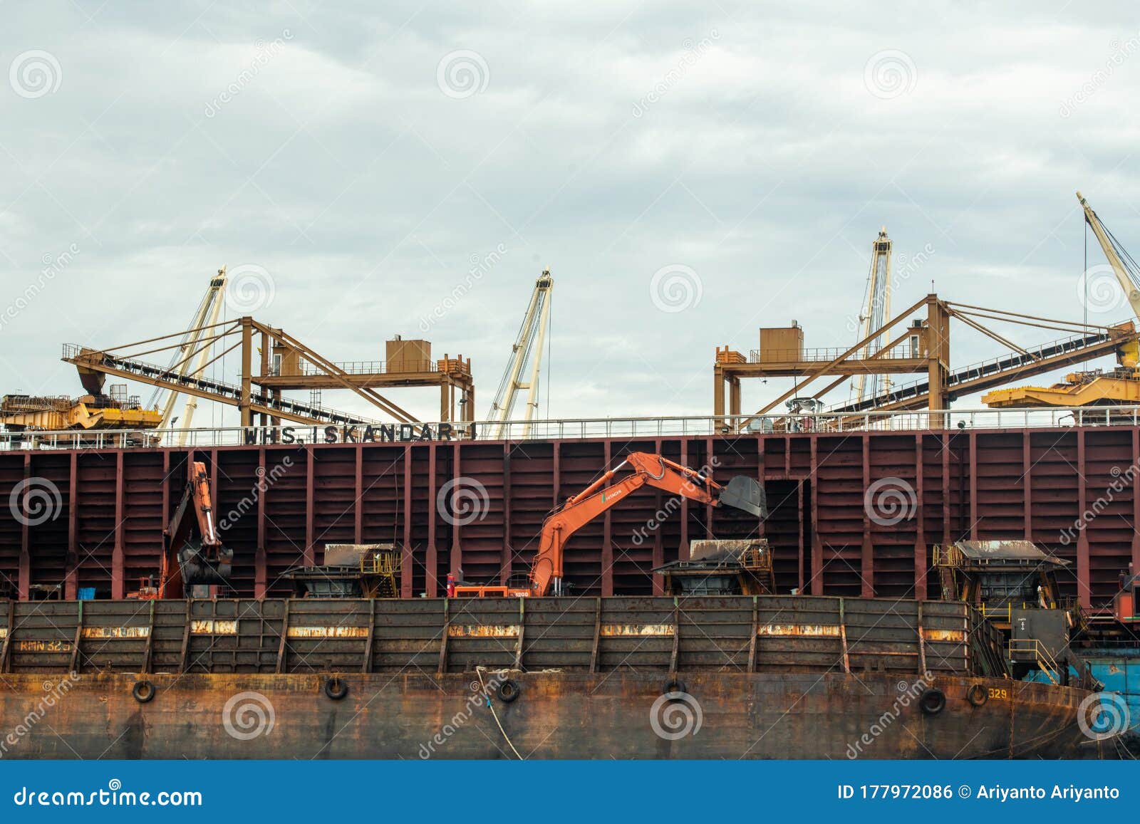 Loading Coal from Cargo Barges Onto a Bulk Vessel Using Ship Cranes ...