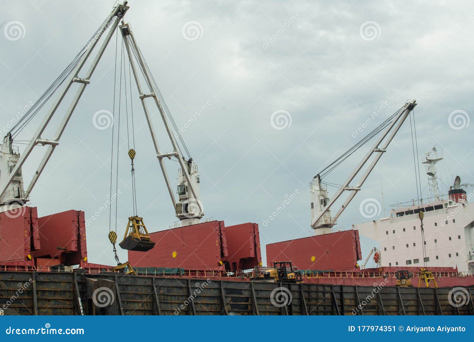 Loading Coal from Cargo Barges Onto a Bulk Vessel Using Ship Cranes ...