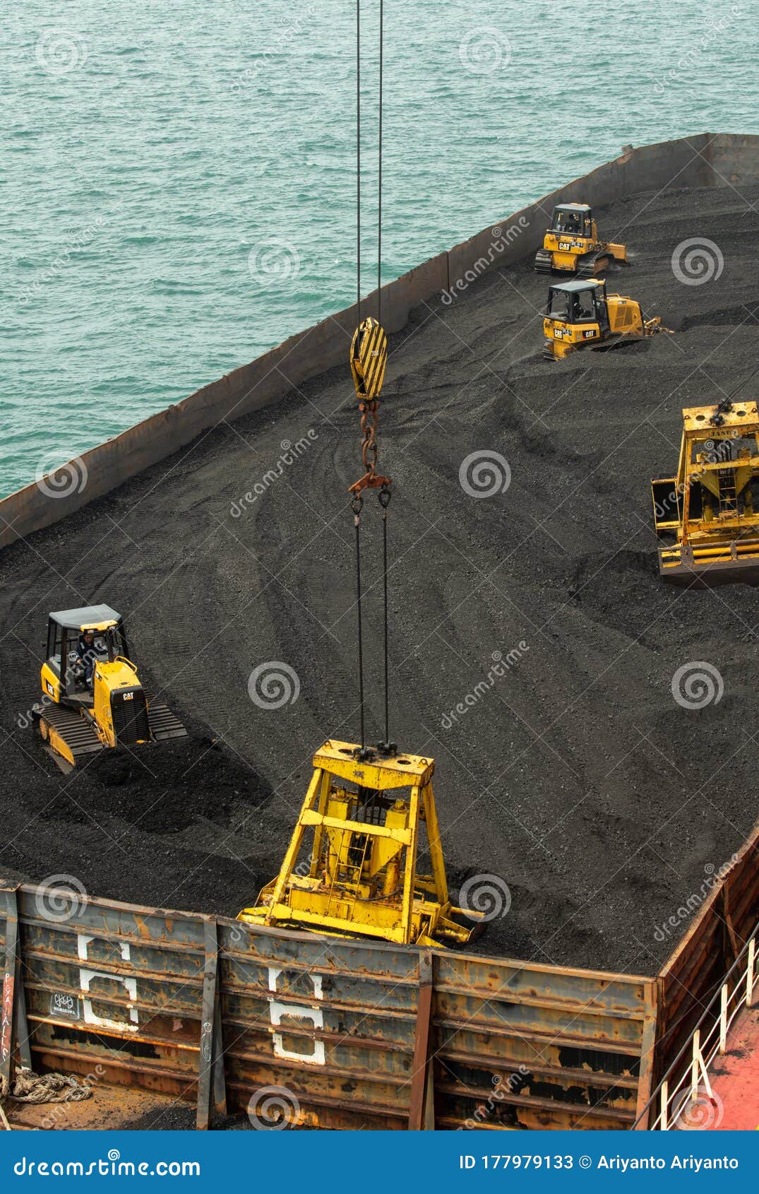 Loading Coal from Cargo Barges Onto a Bulk Vessel Using Ship Cranes ...