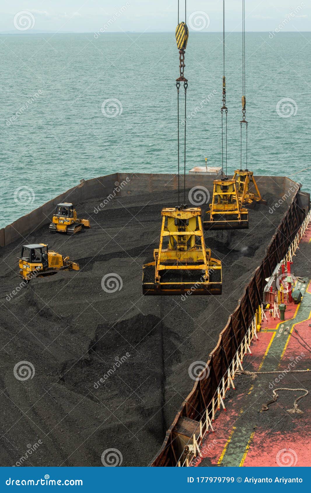 Loading Coal from Cargo Barges Onto a Bulk Vessel Using Ship Cranes ...