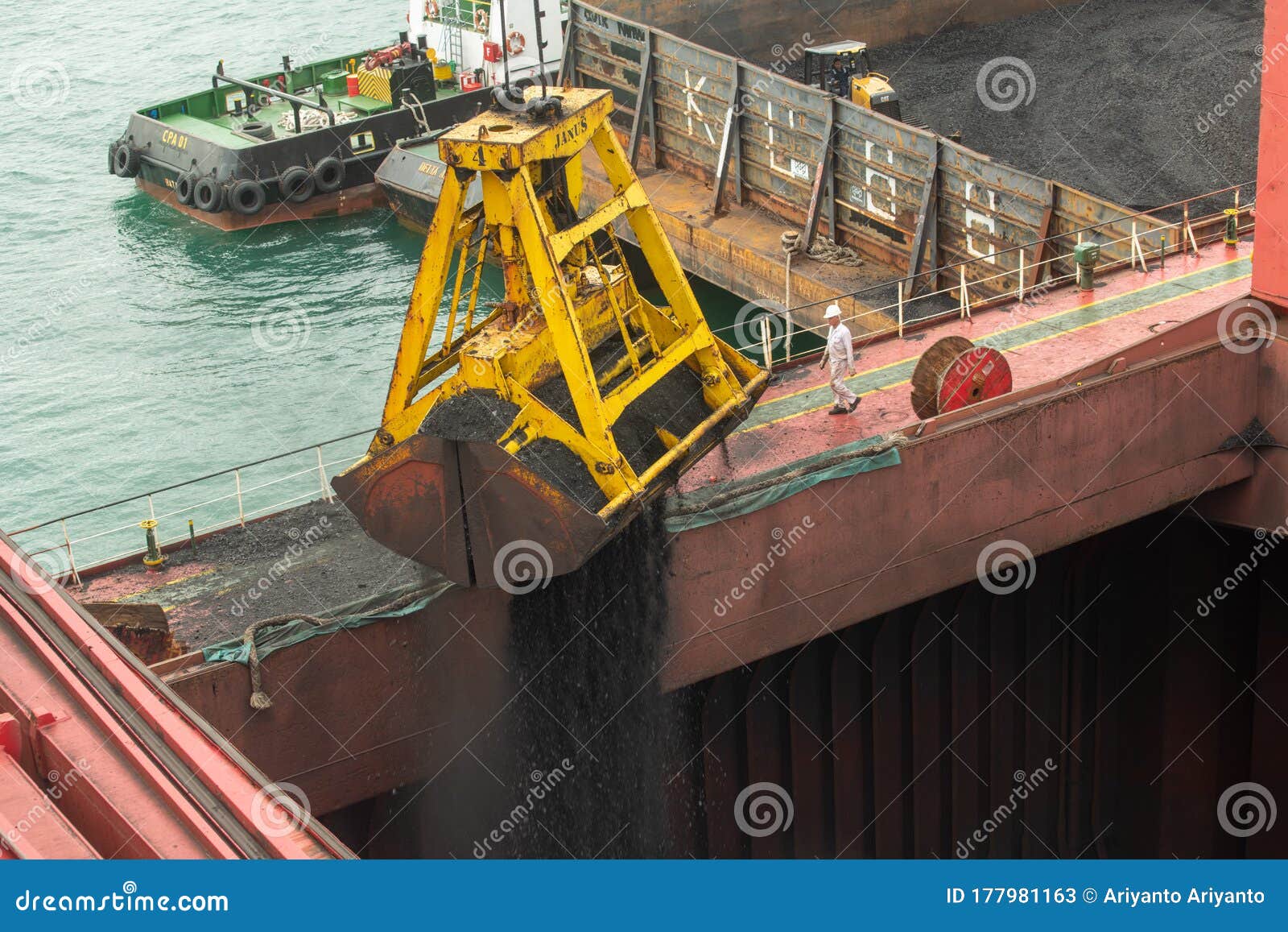 Loading Coal from Cargo Barges Onto a Bulk Vessel Using Ship Cranes in ...