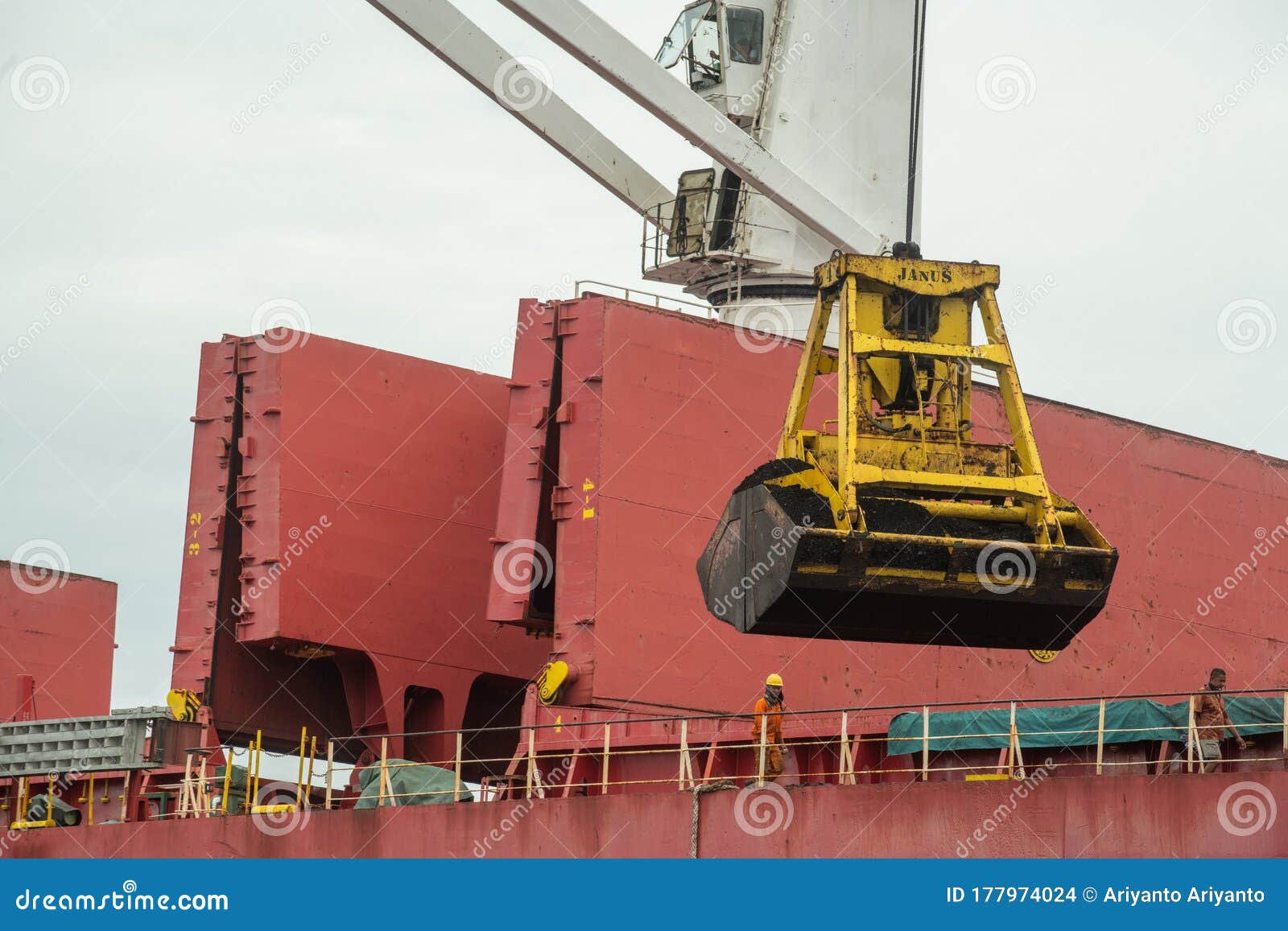 Loading Coal from Cargo Barges Onto a Bulk Vessel Using Ship Cranes ...