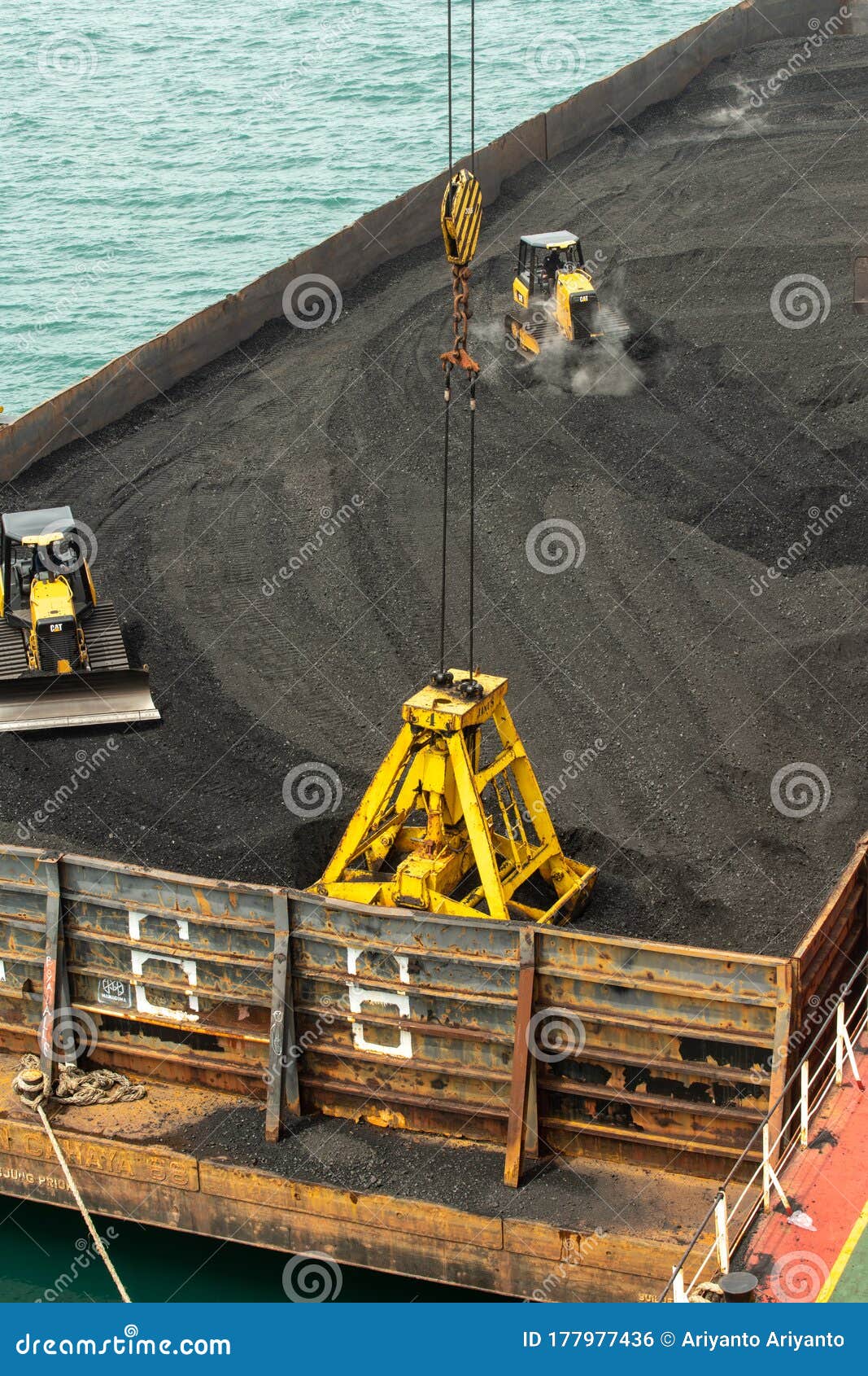Loading Coal from Cargo Barges Onto a Bulk Vessel Using Ship Cranes ...