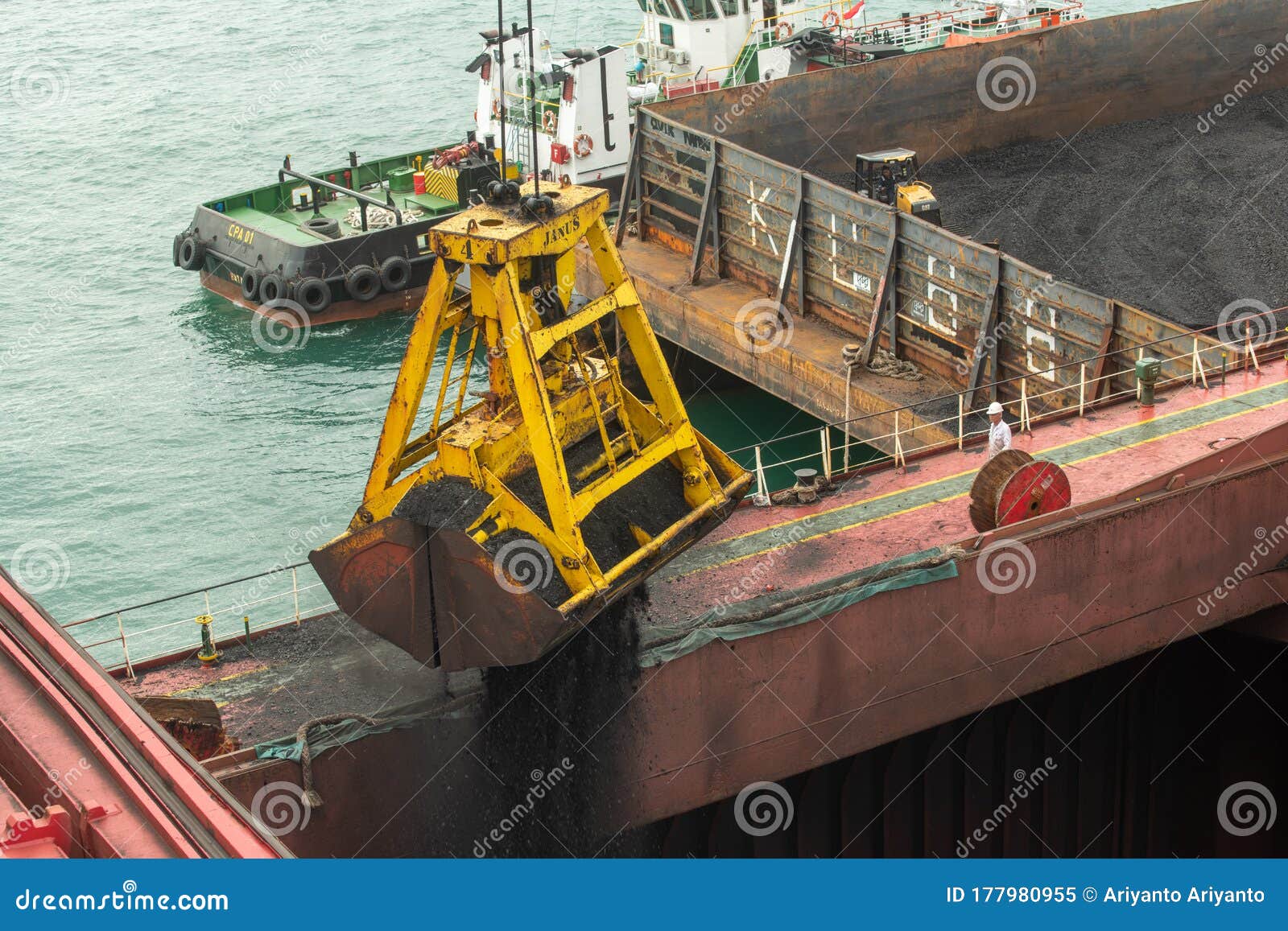 Loading Coal from Cargo Barges Onto a Bulk Vessel Using Ship Cranes in ...