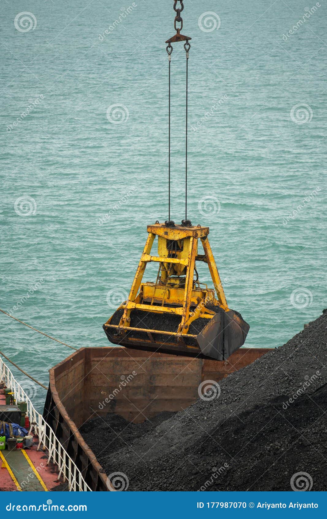 Loading Coal from Cargo Barges Onto a Bulk Vessel Using Ship Cranes in ...