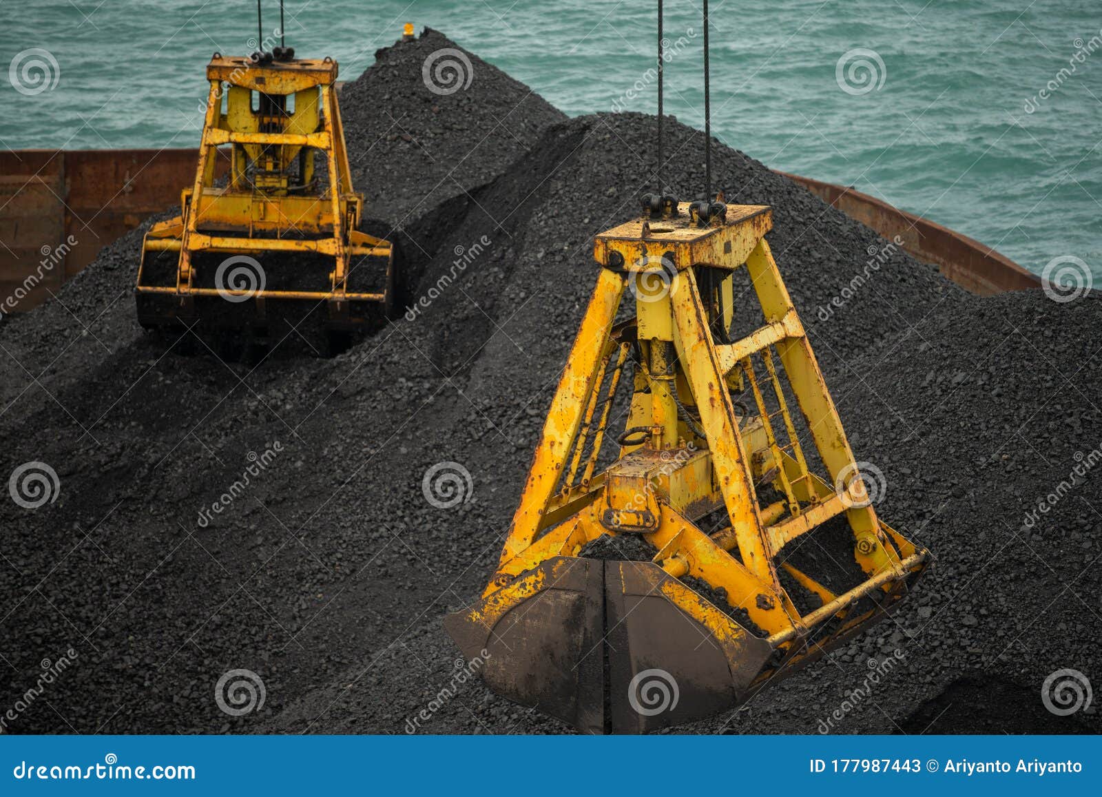 Loading Coal from Cargo Barges Onto a Bulk Vessel Using Ship Cranes in ...