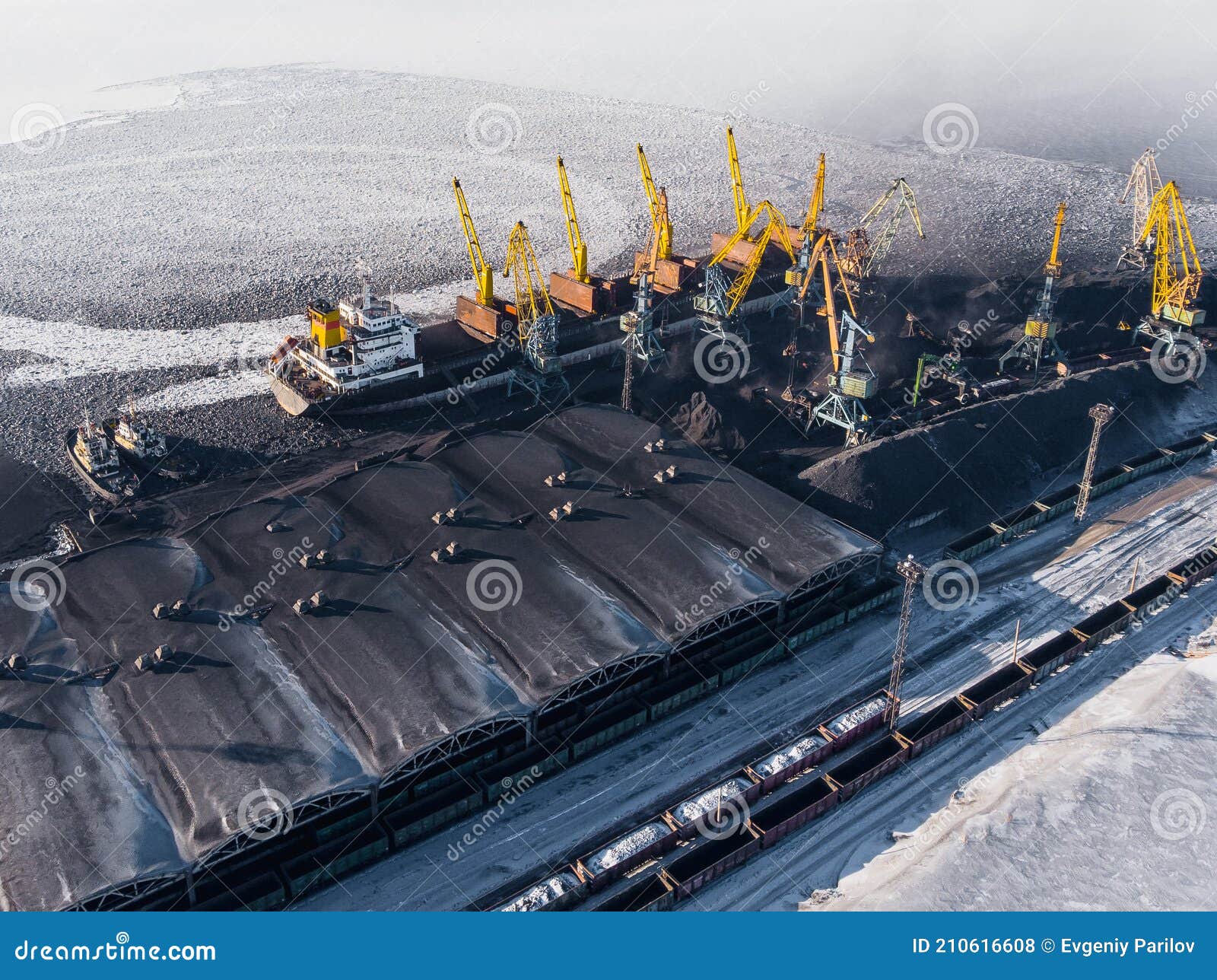 Loading Coal Mining in Port on Cargo Tanker Ship with Crane Bucket of ...