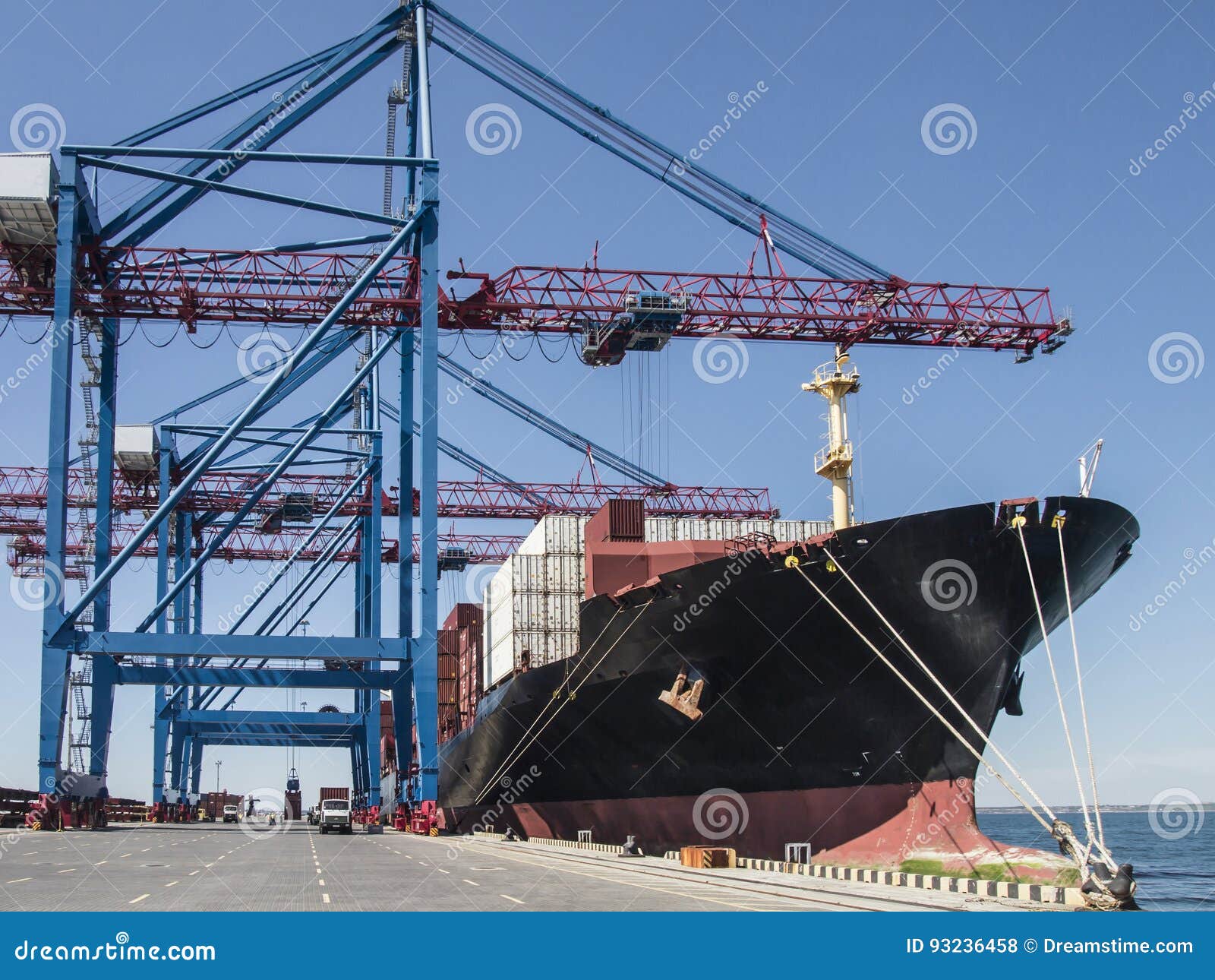 Loading a Container Carrier Stock Photo - Image of industry, crane ...