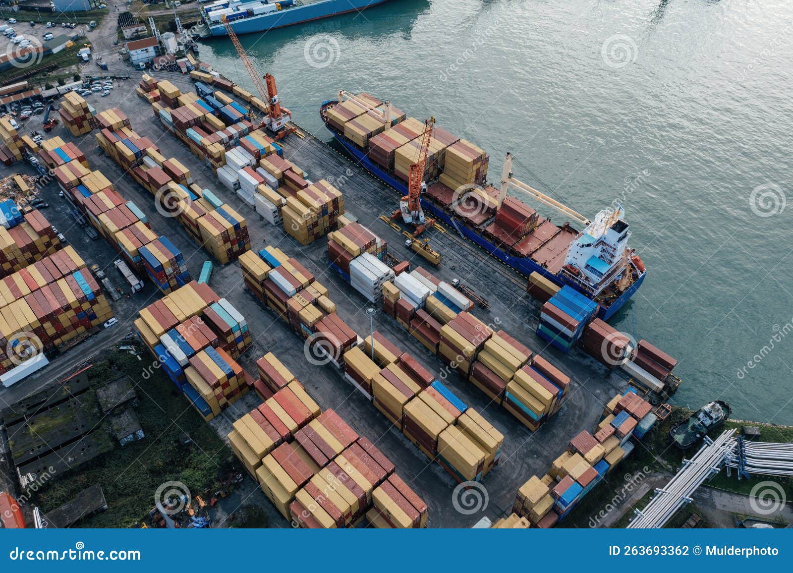 Loading of Containers into Cargo Ship in the Harbor Stock Photo - Image ...