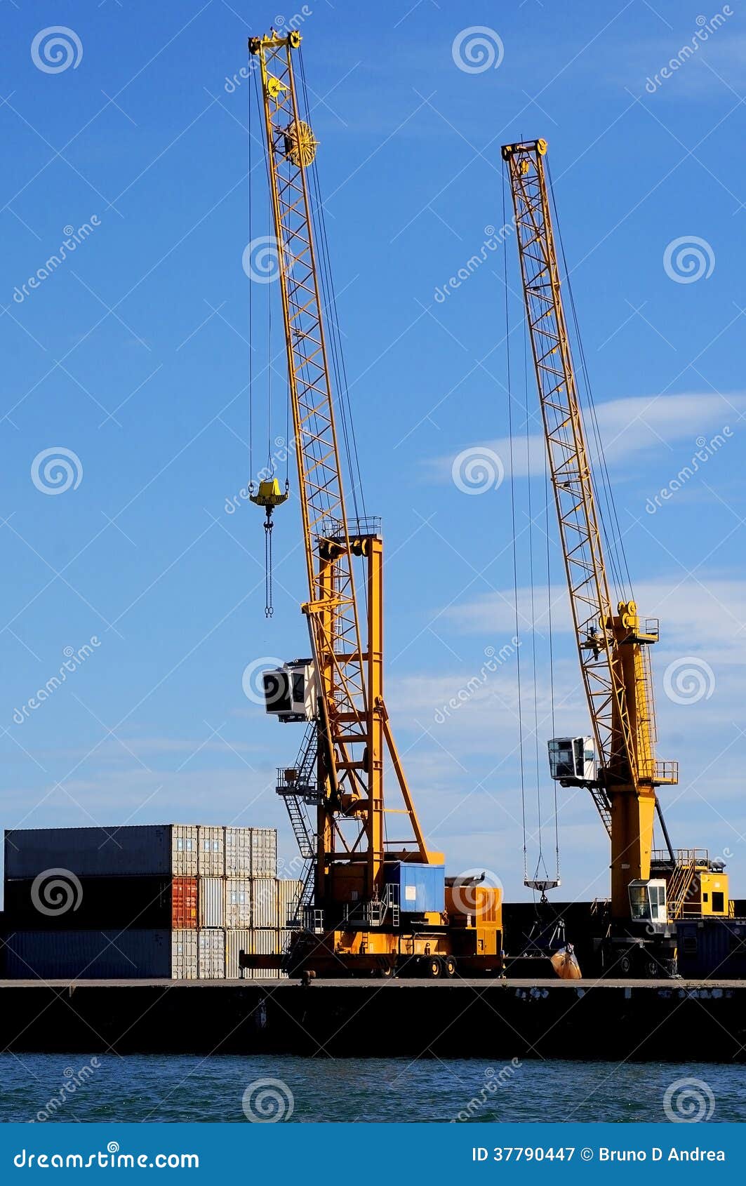 Loading cranes by the sea stock image. Image of transport - 37790447