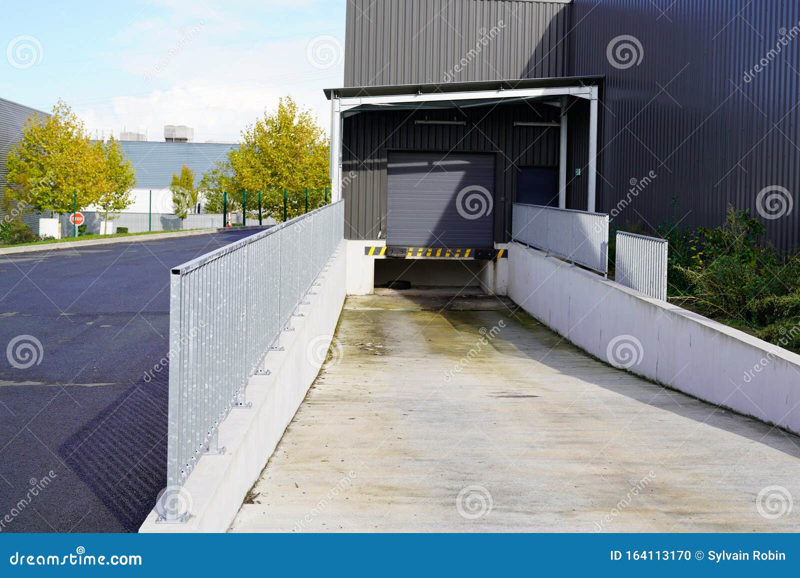 Loading Dock Door for Trucks Delivery at Warehouse Stock Photo - Image ...