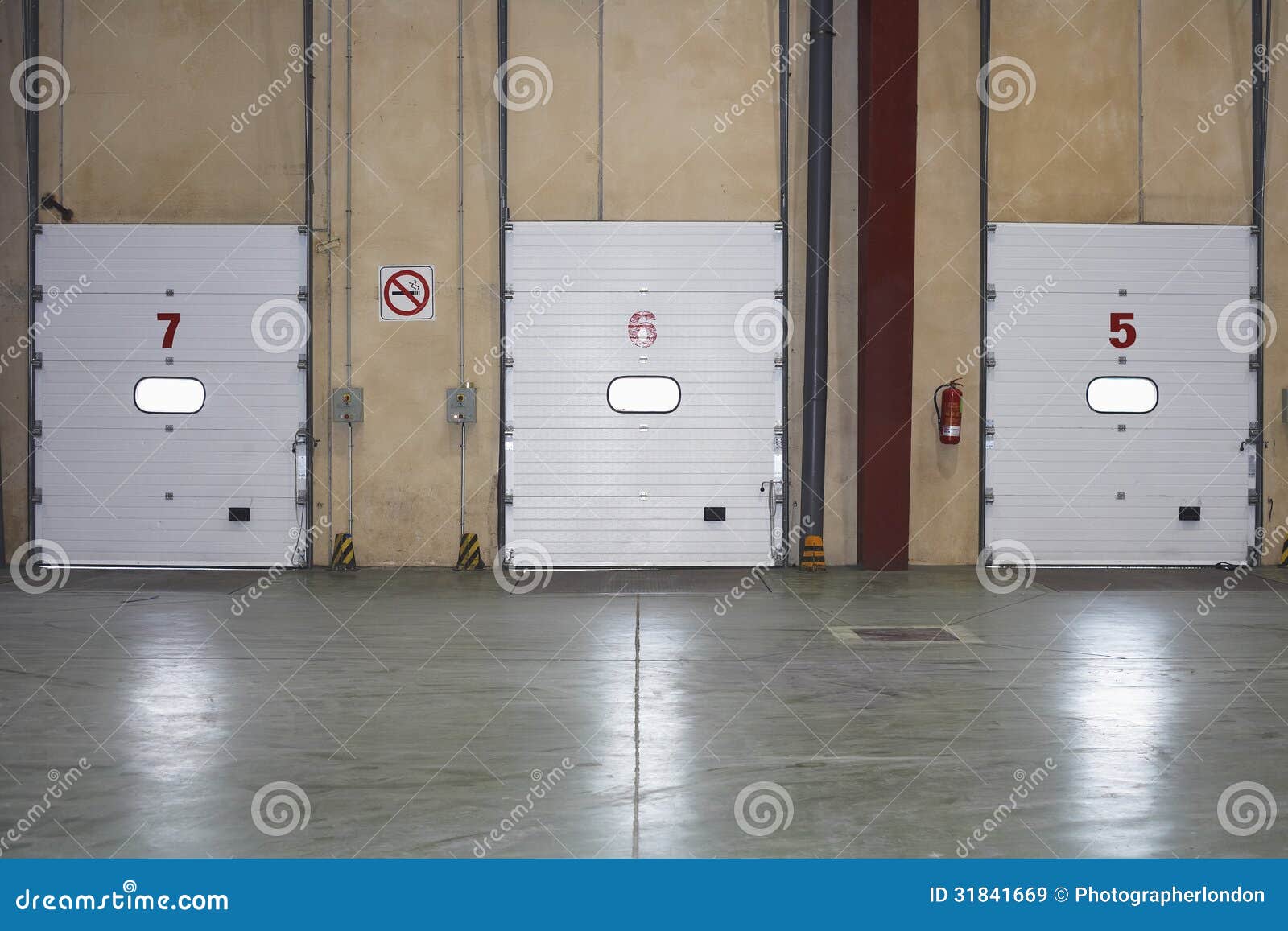 Loading Dock Doors in Warehouse Stock Image - Image of indoors, cargo ...