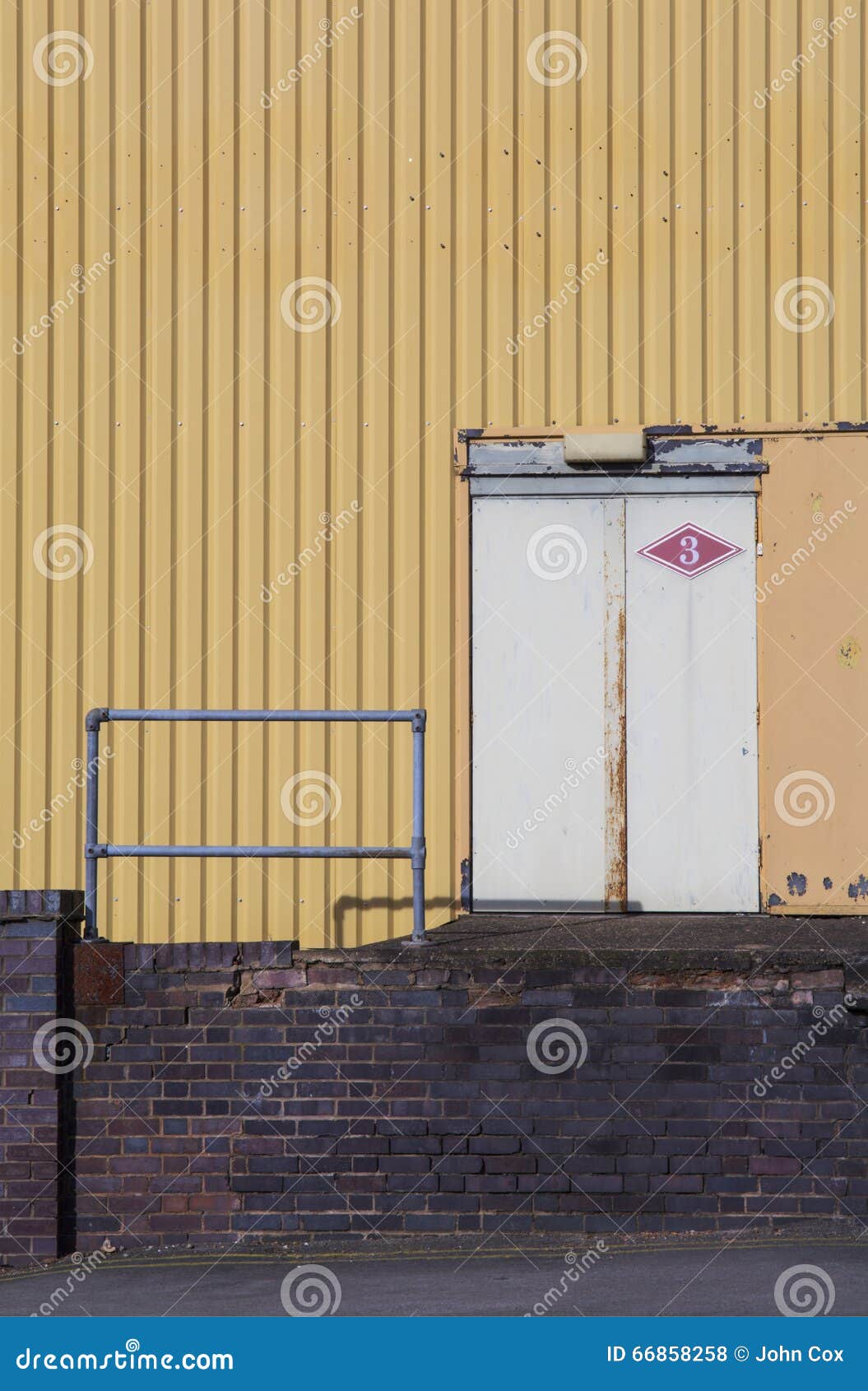 Loading Dock Number 3 Yellow Wall Stock Photo - Image of entrance ...