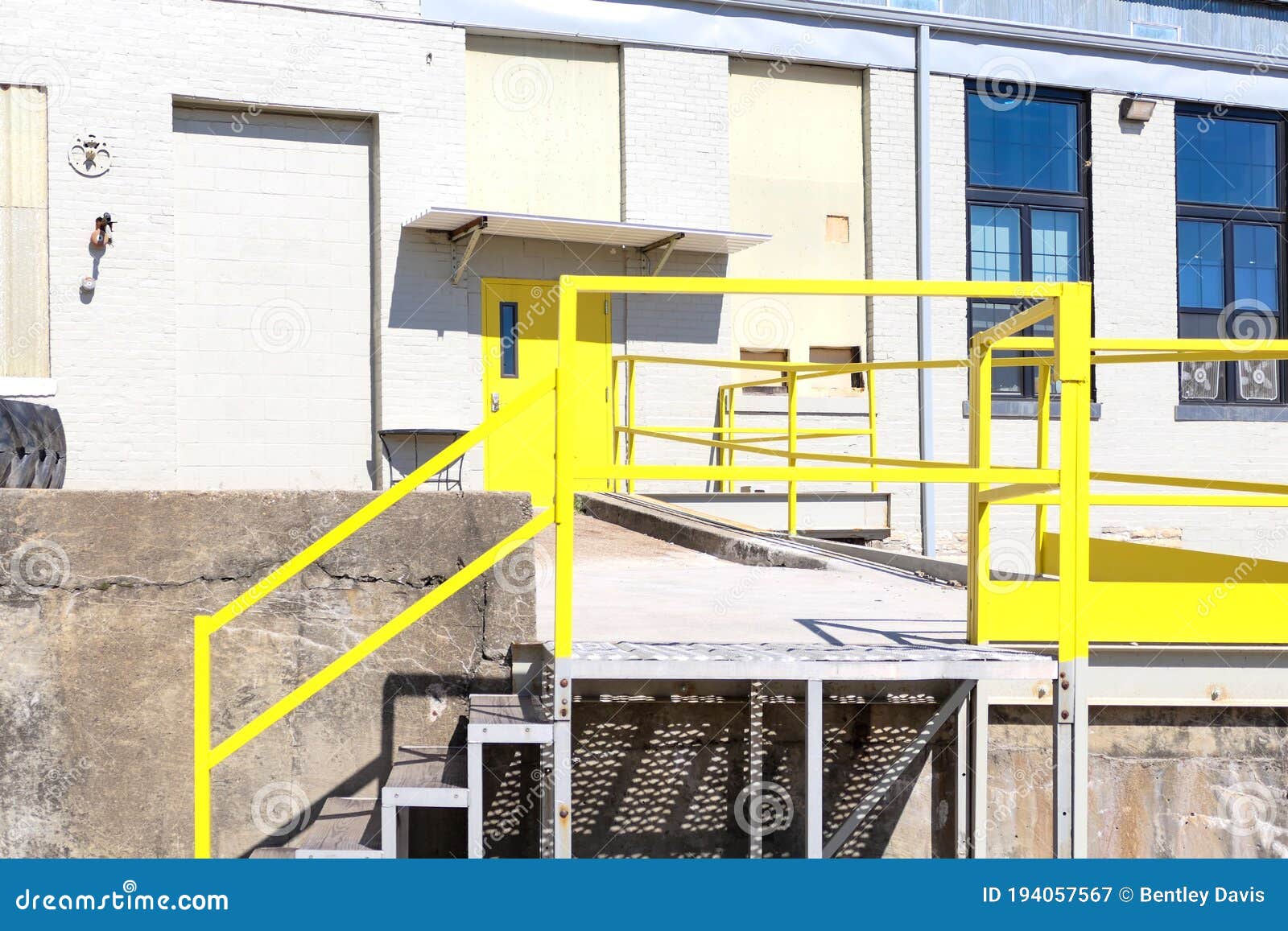 A Loading Dock with a Yellow Fence Stock Image - Image of dock ...
