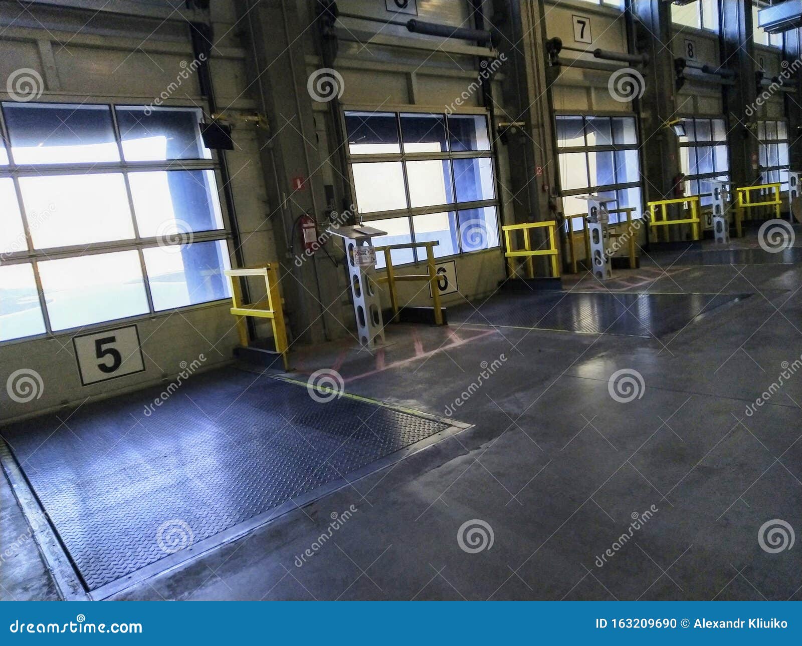 Loading Docks for Trucks in Warehouse, Angle View Stock Photo - Image ...