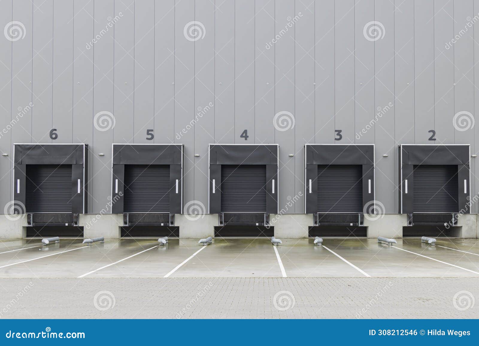 Loading docks of warehouse stock photo. Image of import - 308212546