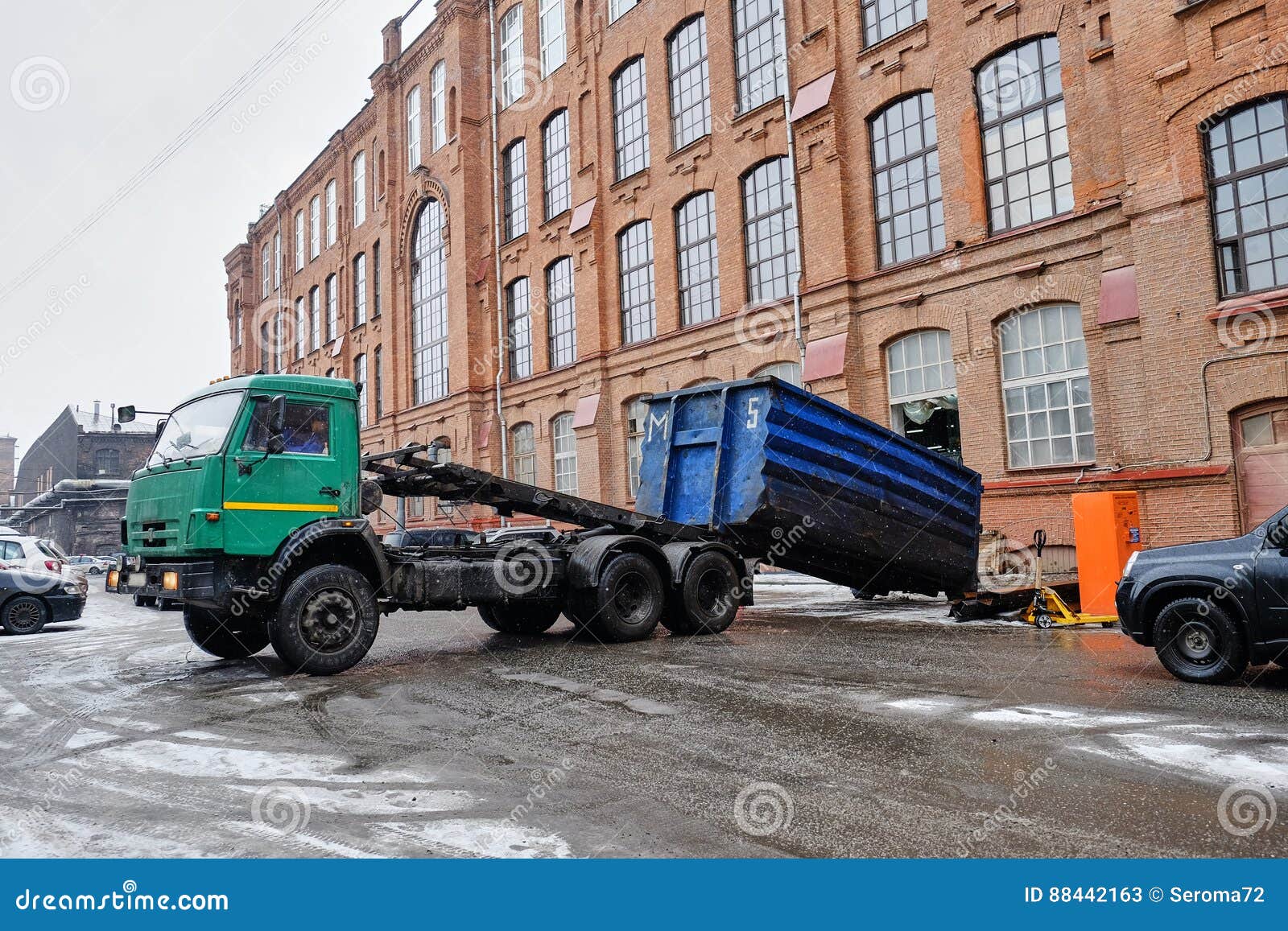 Loading the dumpster editorial stock photo. Image of blue - 88442163